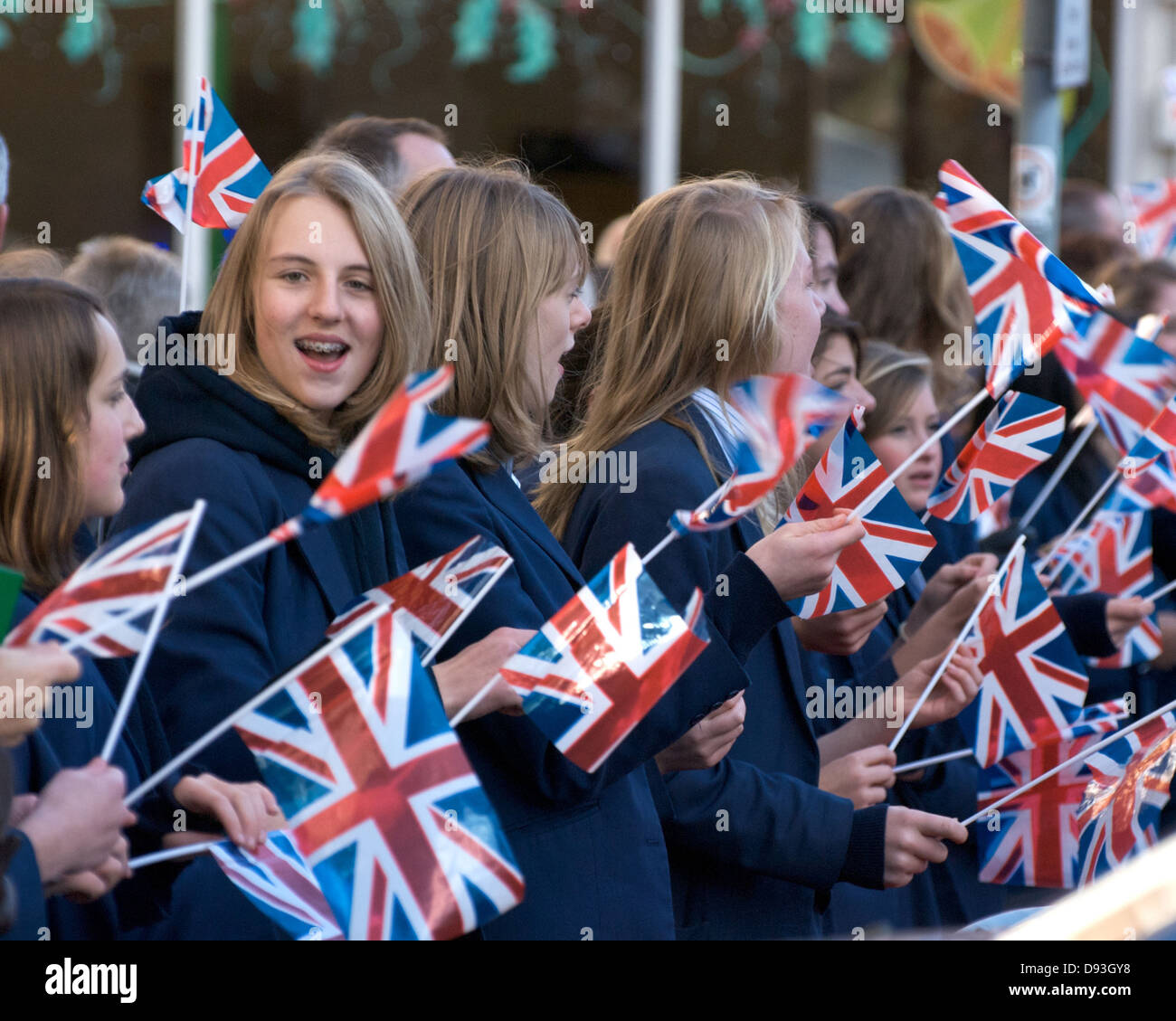 School girls waving union jack flags hi-res stock photography and ...