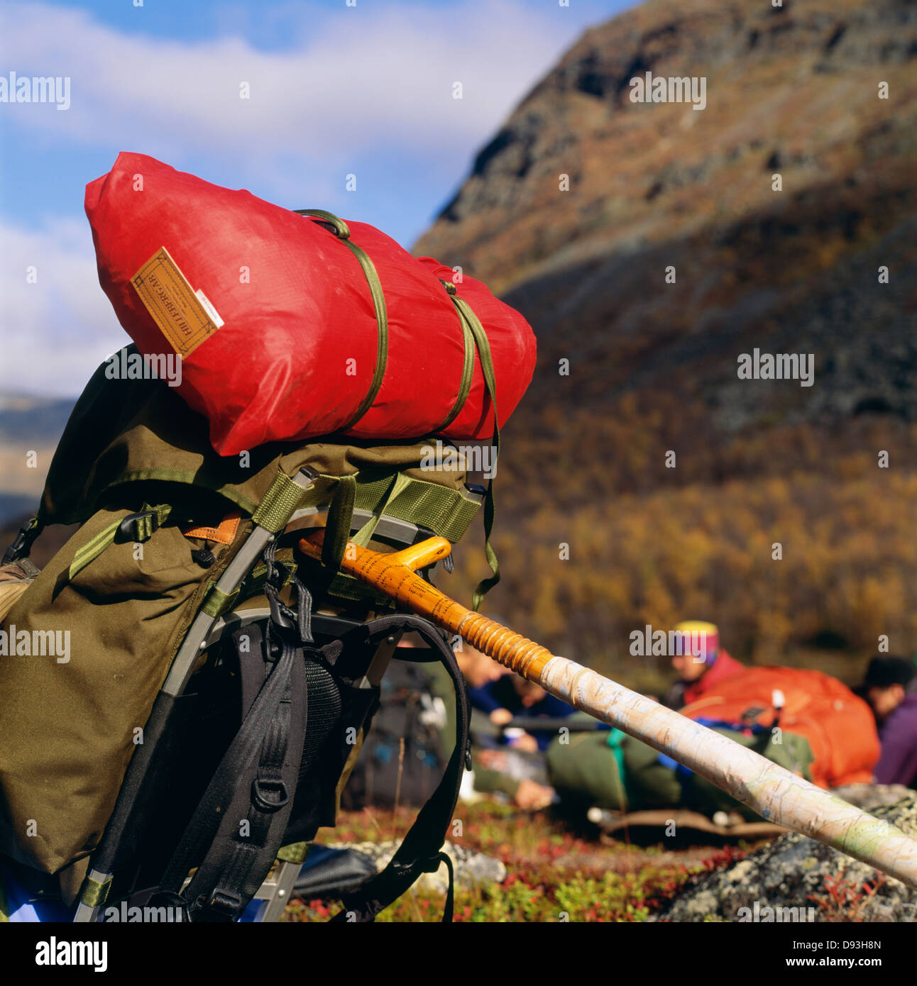 Backpack leaned on stick, close-up Stock Photo - Alamy