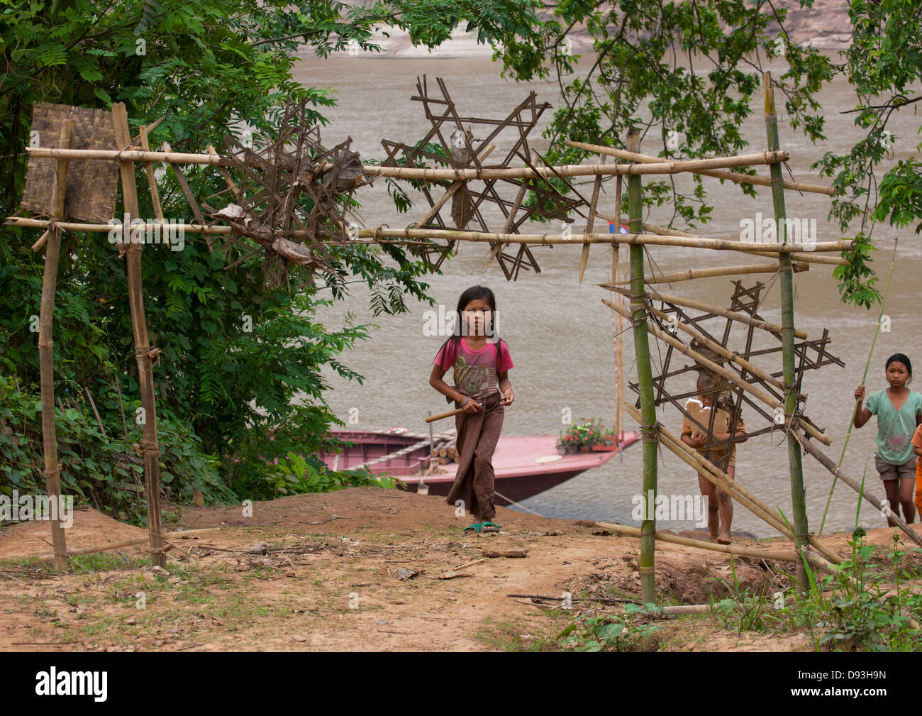 Khmu Minority Girl Passing Under The Traditional Gate, Xieng Khouang ...