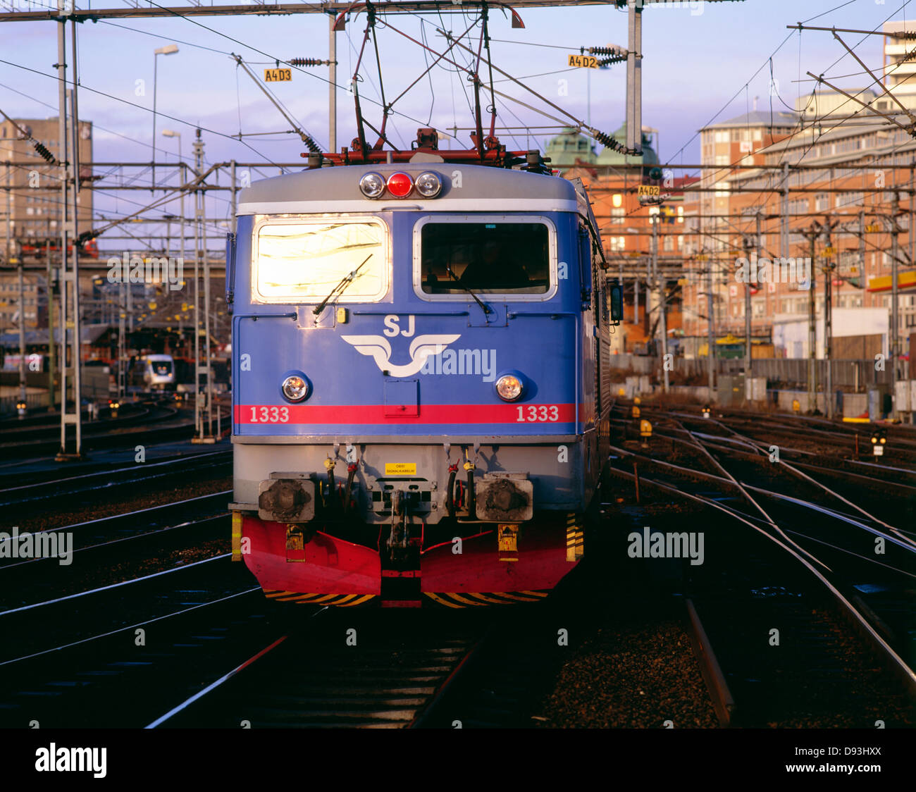 Train travelling through railway tracks Stock Photo - Alamy