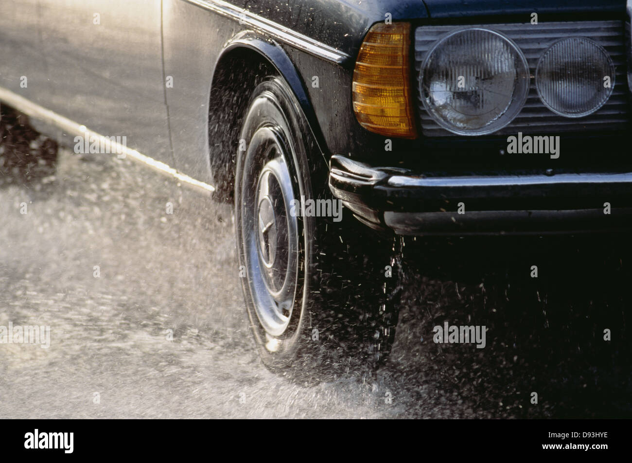 Car splashing water Stock Photo - Alamy