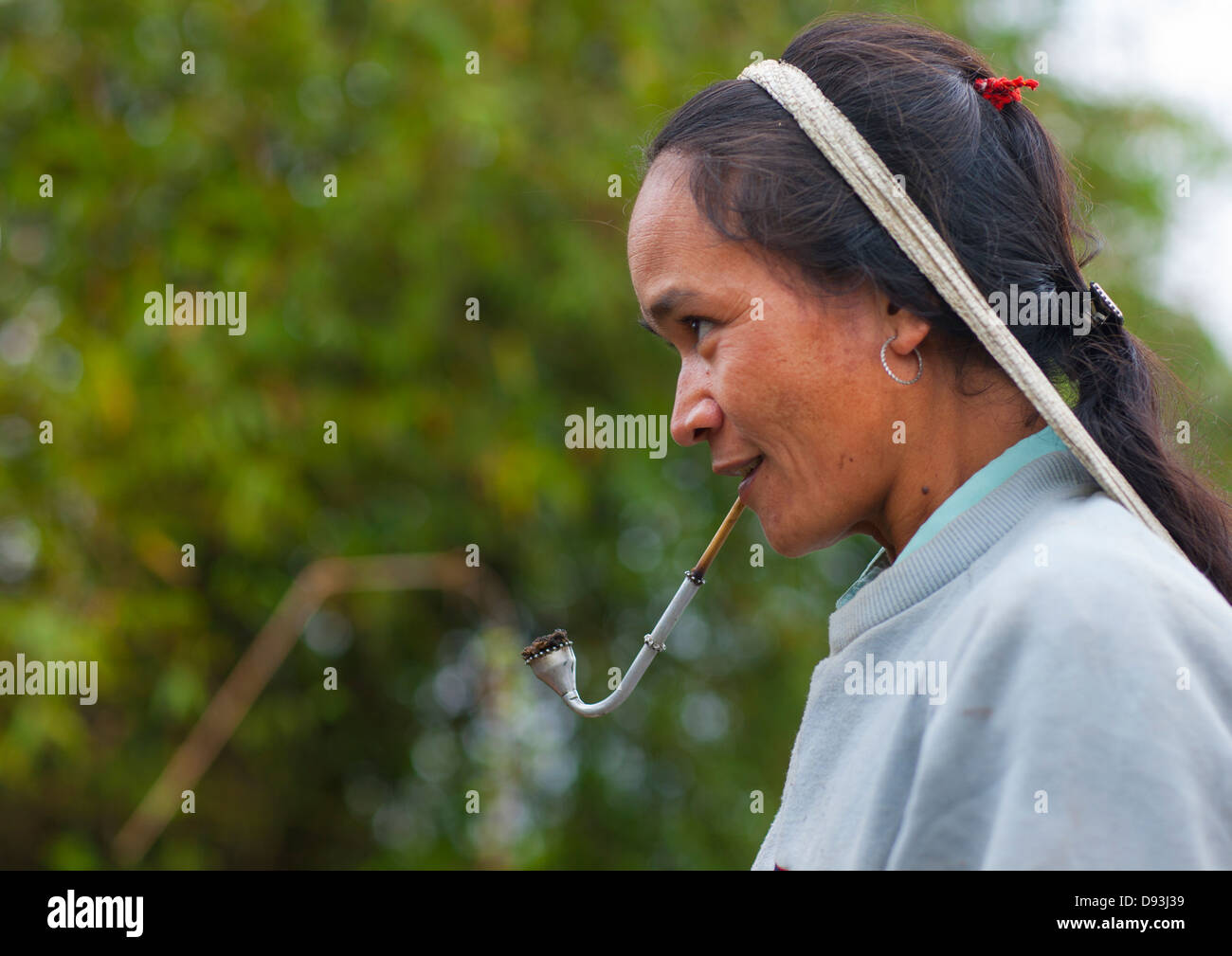 Asian woman smoking pipe hi-res stock photography and images - Alamy