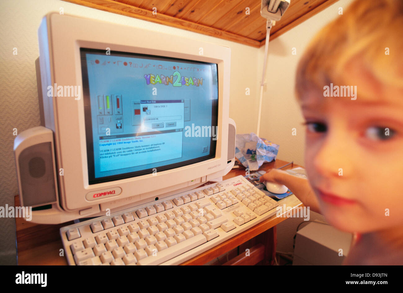 Boy working on computer Stock Photo - Alamy