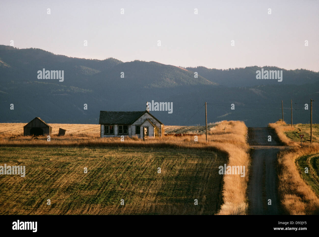 View of field with house Stock Photo - Alamy