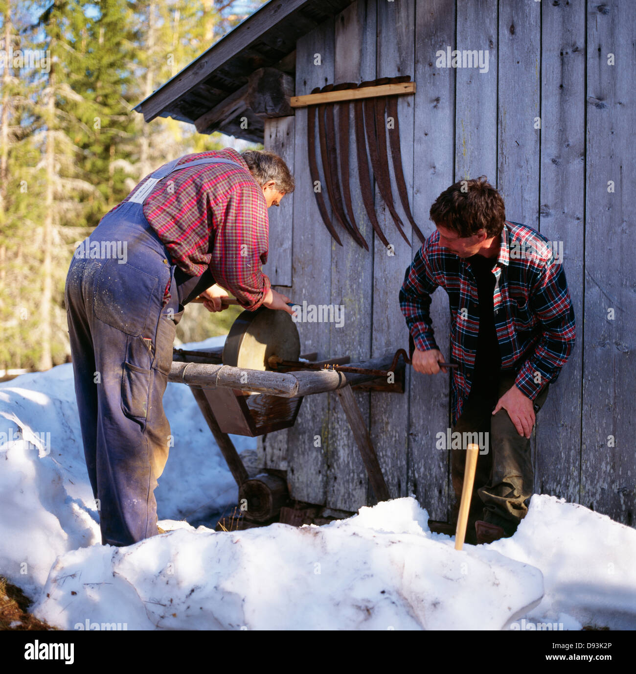 Men working at grinding wheel Stock Photo - Alamy