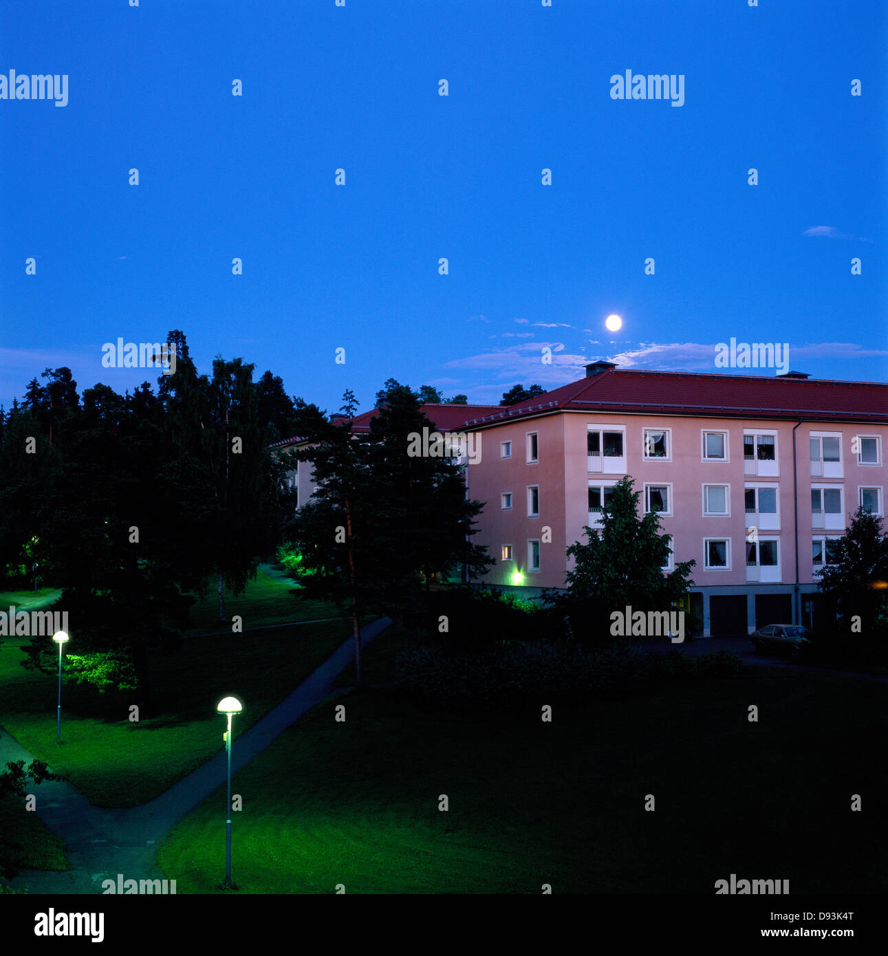 Moonlight over apartment buildings Stock Photo - Alamy