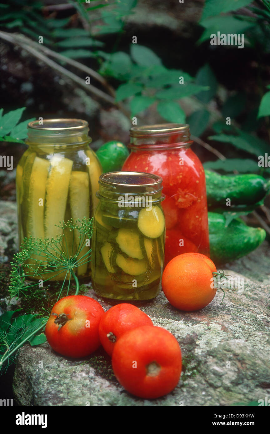Traditional home-preserved pickles and tomatoes. Photograph Stock Photo ...