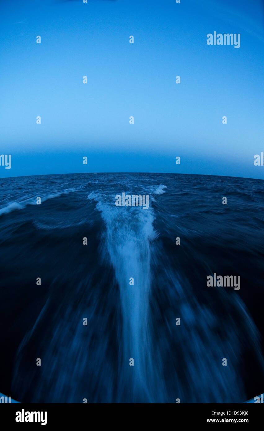 A wave formed behind a sailing-boat, Sweden Stock Photo - Alamy