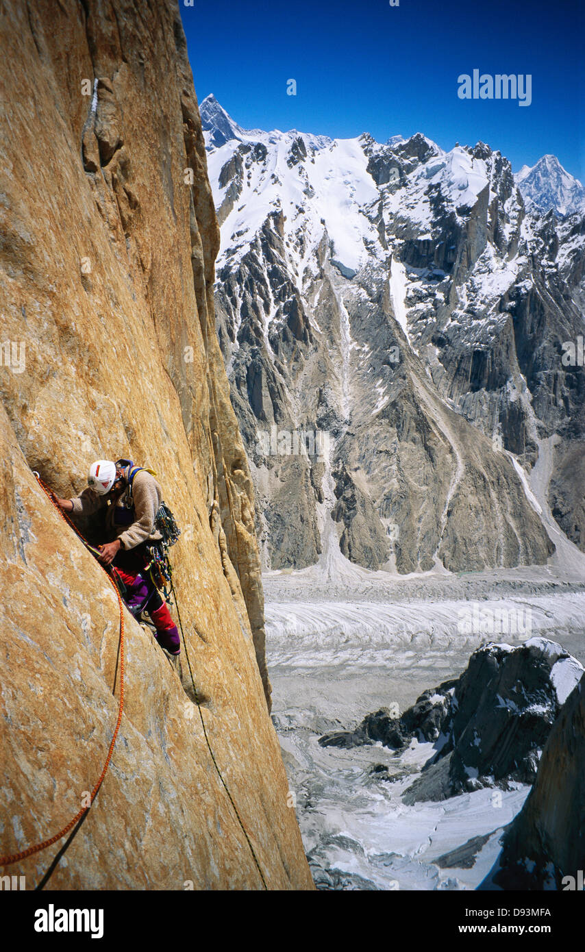 Person climbing rock, side view Stock Photo - Alamy