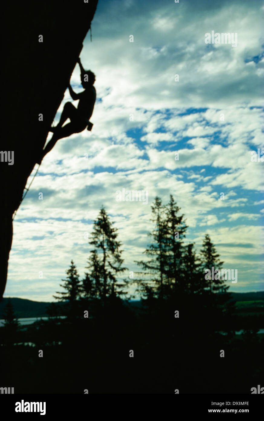 Person climbing rock, side view Stock Photo - Alamy