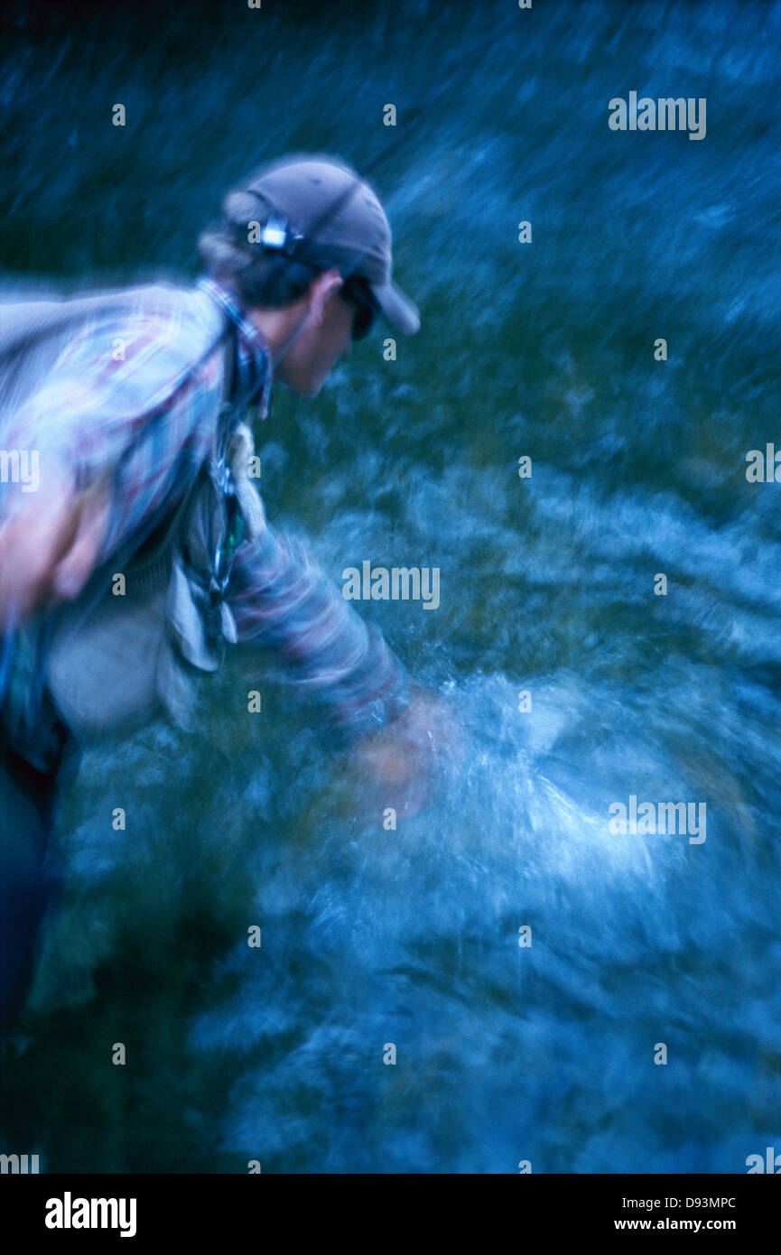 Man putting hand in water Stock Photo - Alamy