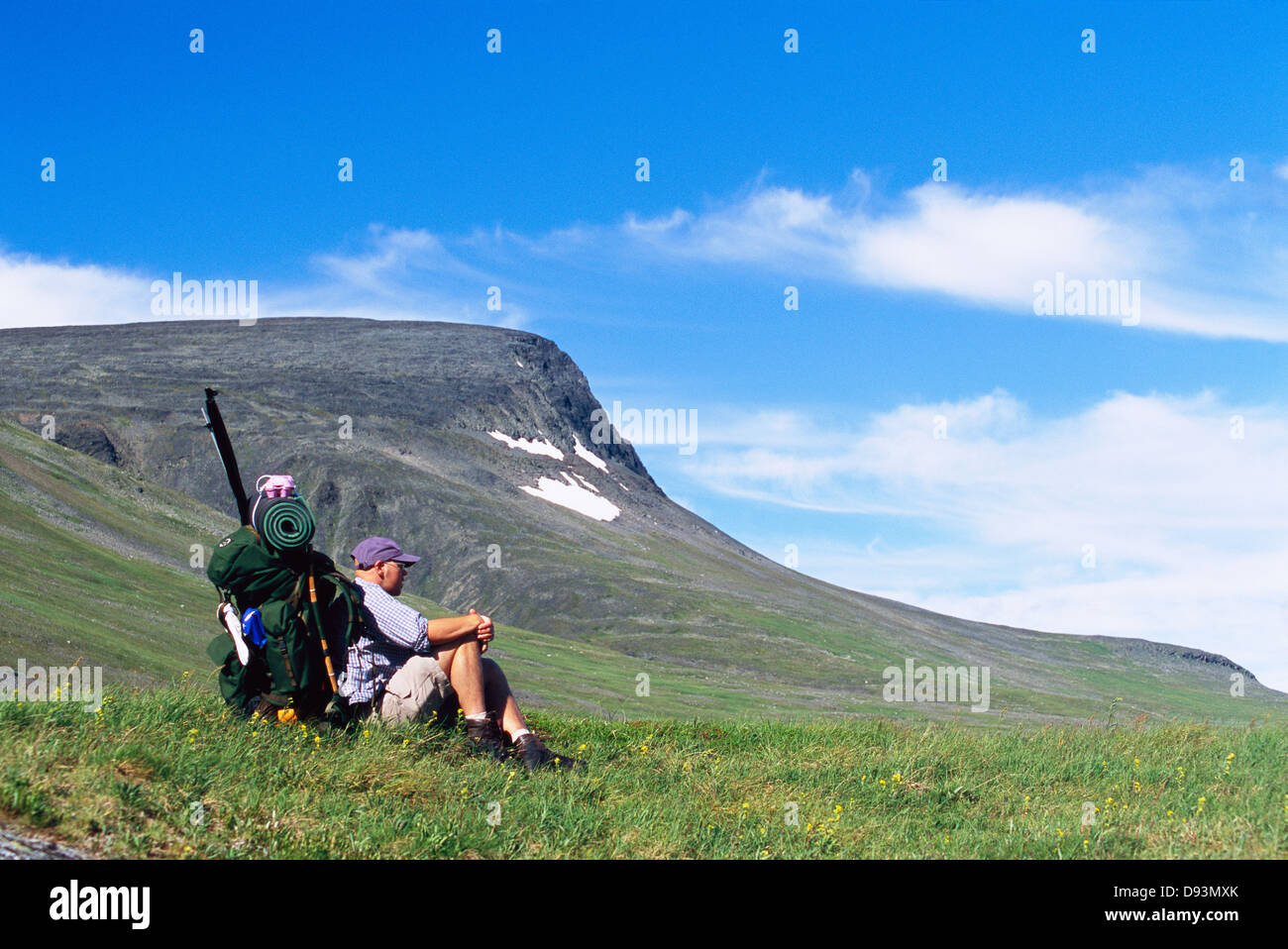 Man sitting near bag Stock Photo - Alamy