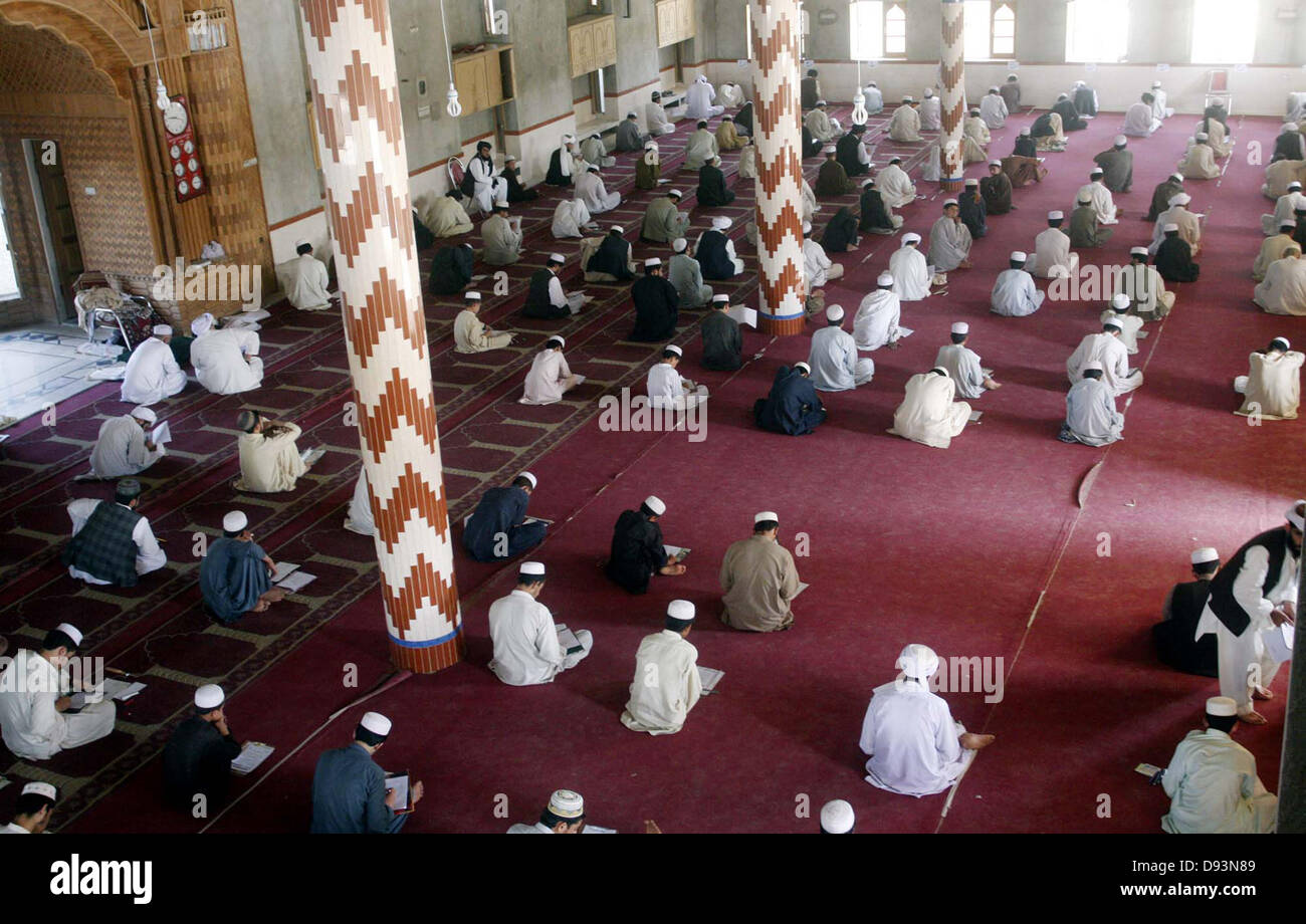 Students of Islamic seminary solve papers during Annual Examination at ...