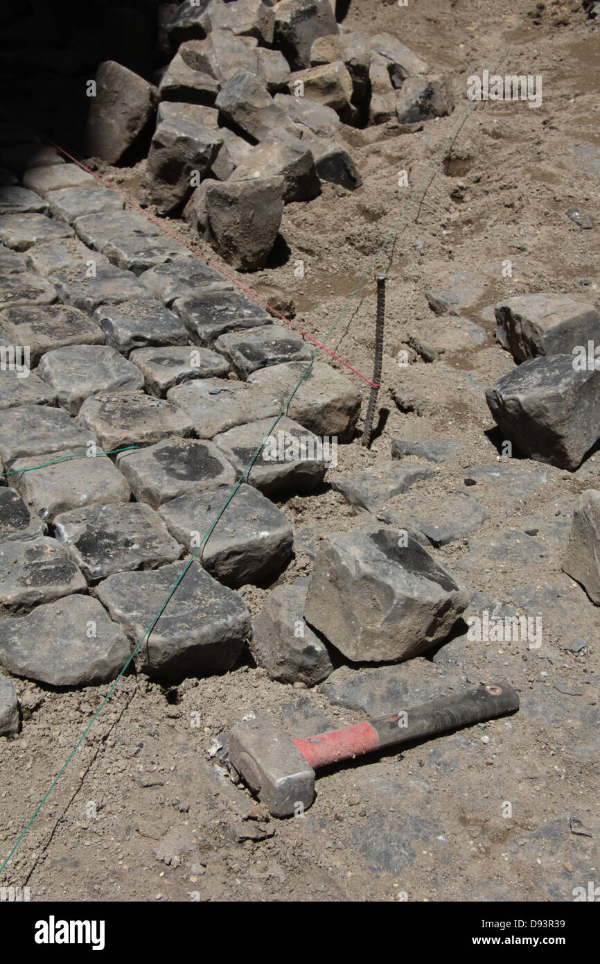 cobble stones road repair construction in rome italy Stock Photo - Alamy