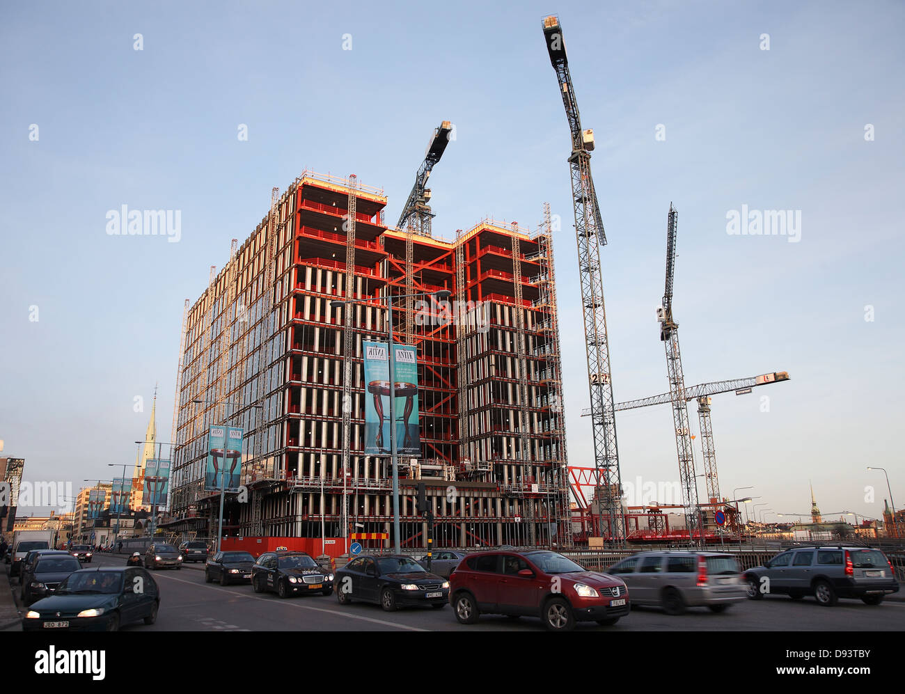 Traffic passing office building construction site Stock Photo - Alamy
