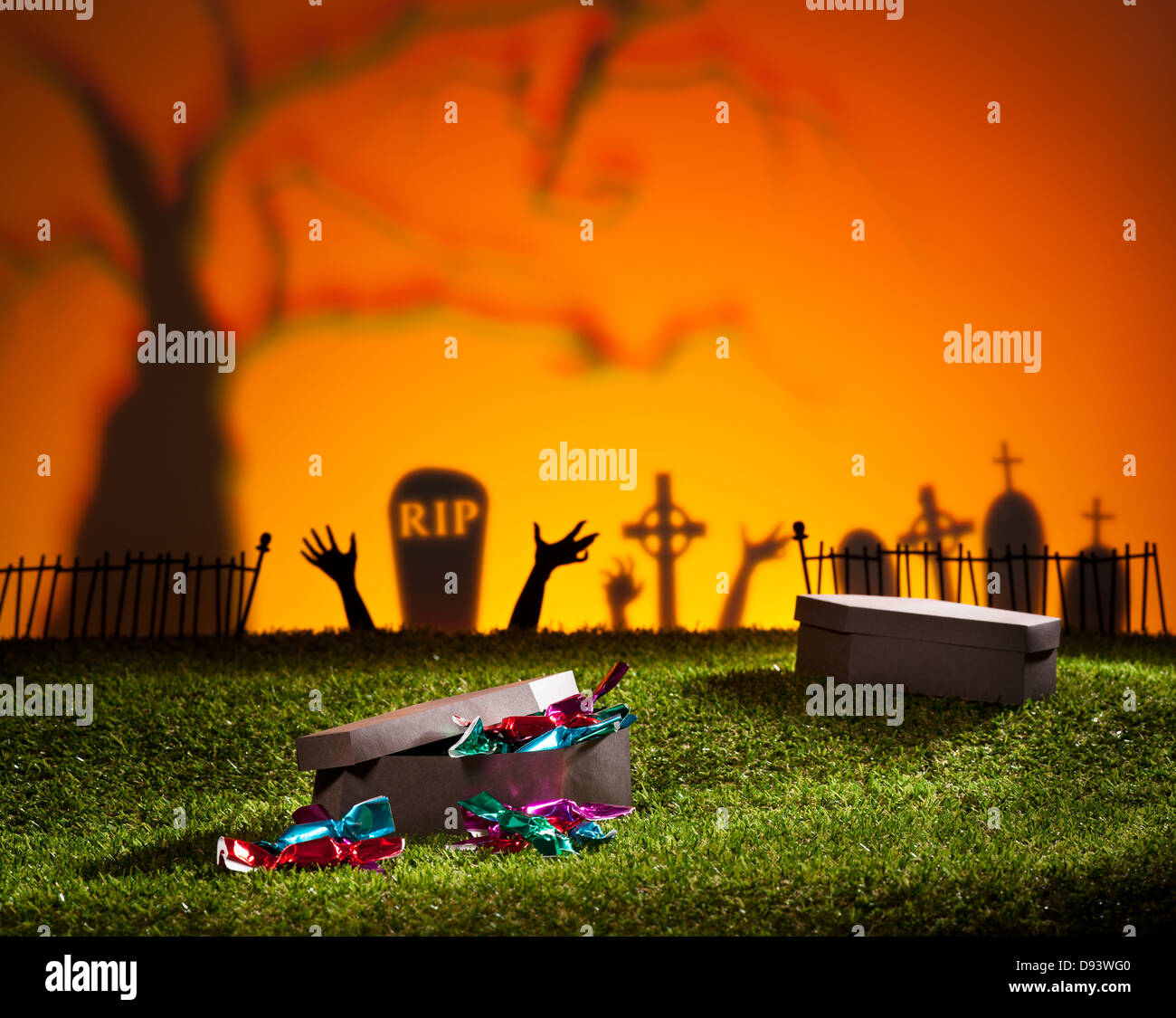 Halloween coffin on lawn with sweets and candies Stock Photo - Alamy