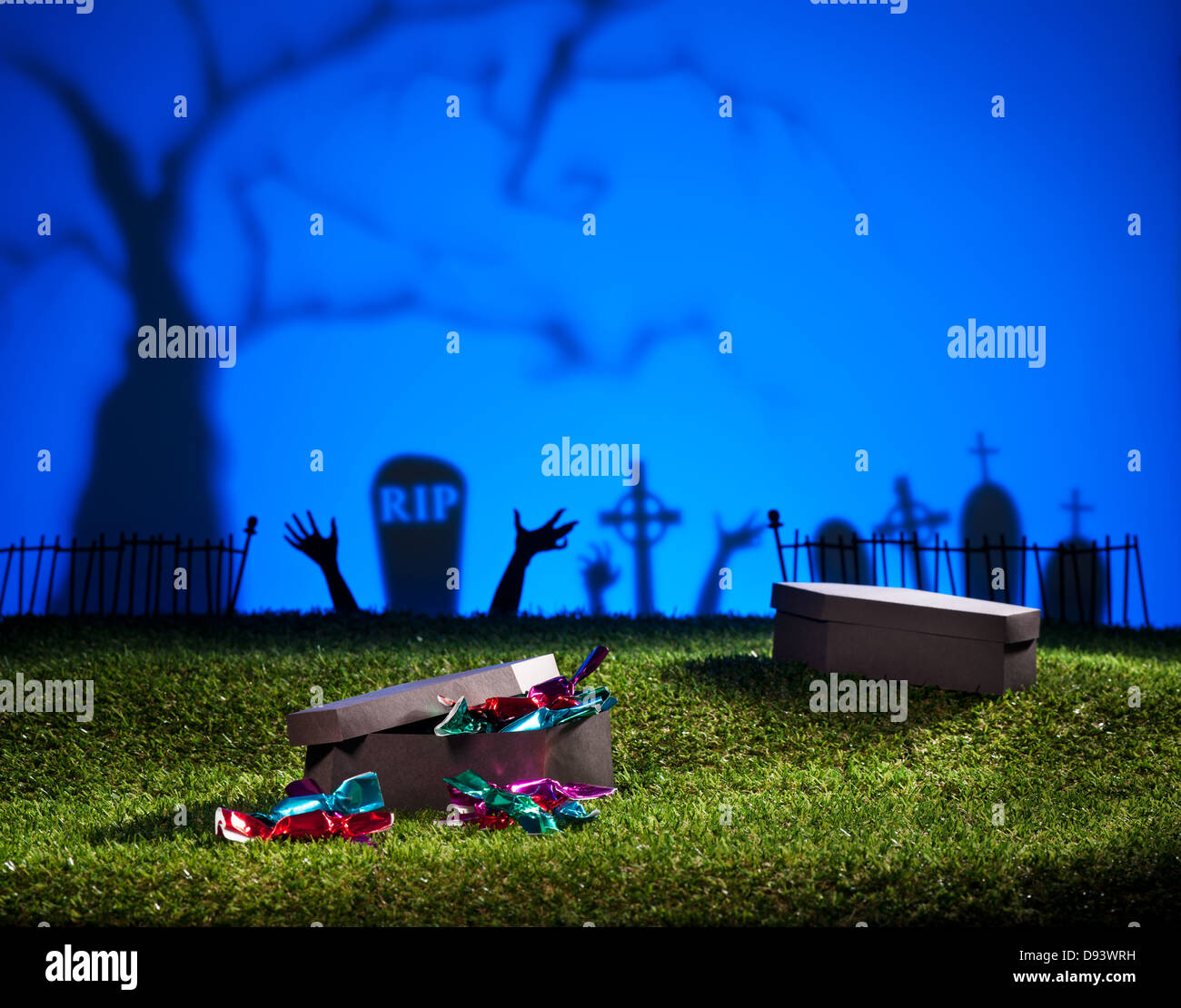 Halloween coffin on lawn with sweets and candies Stock Photo - Alamy