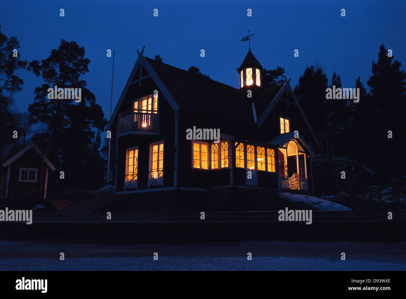 Lit house during night Stock Photo - Alamy