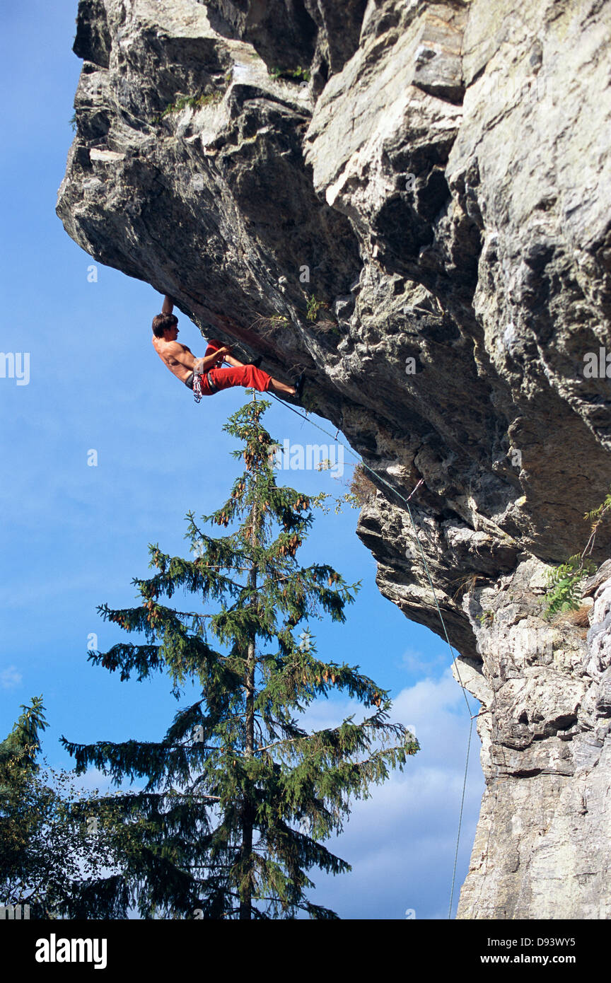 Mountain climbing on a steep cliff Stock Photo - Alamy