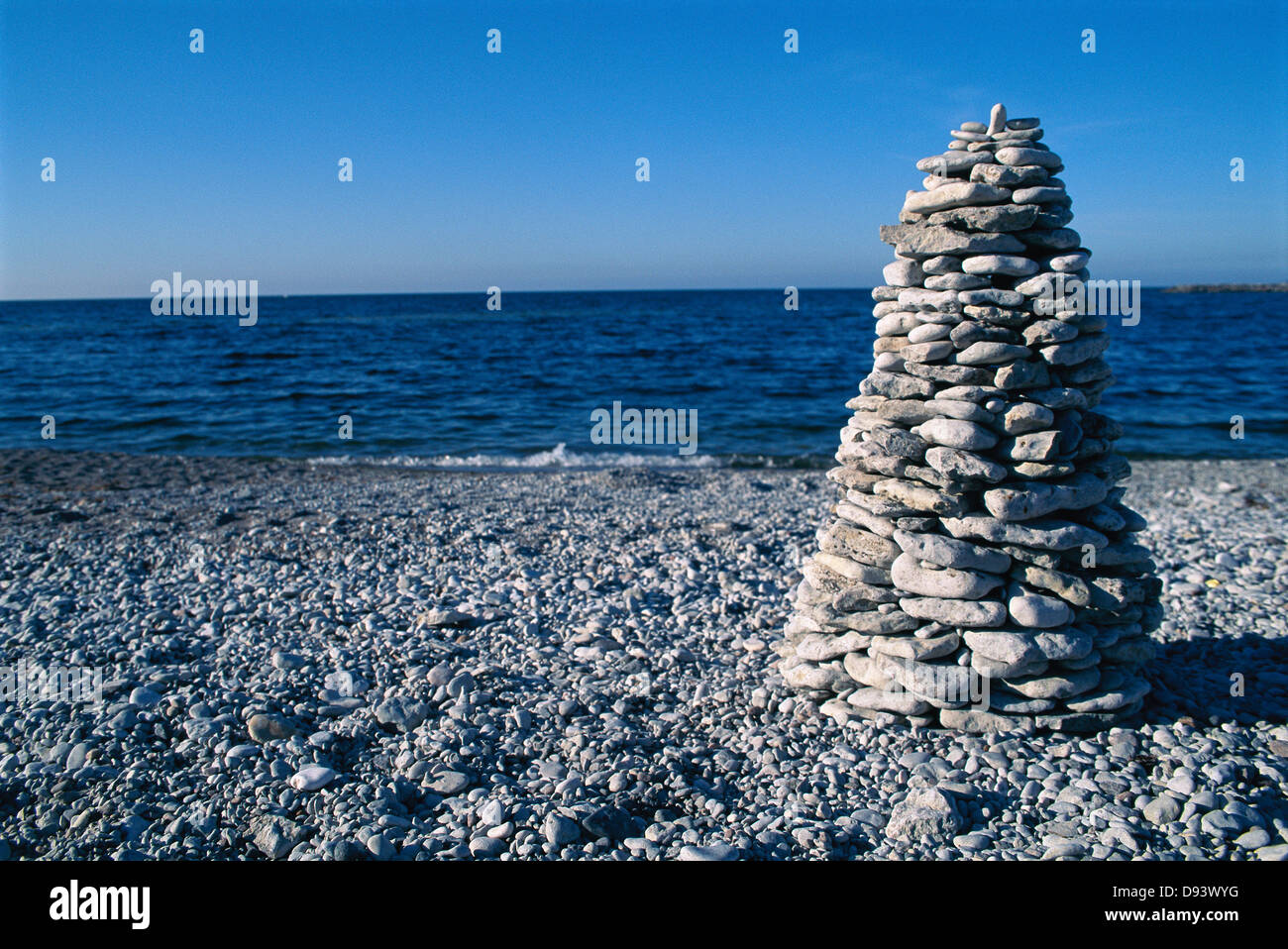 Cairn of stones on a beach Stock Photo - Alamy