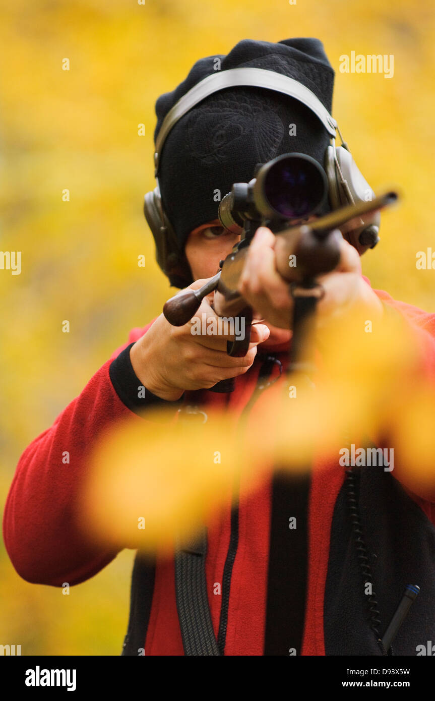 Hunter aiming rifle Stock Photo - Alamy