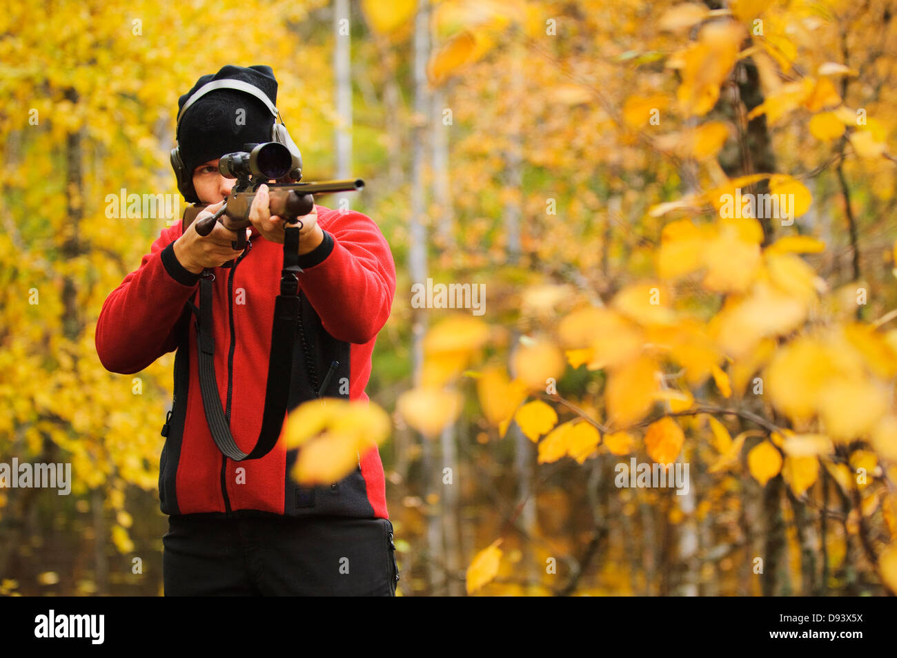 Hunter aiming rifle Stock Photo - Alamy