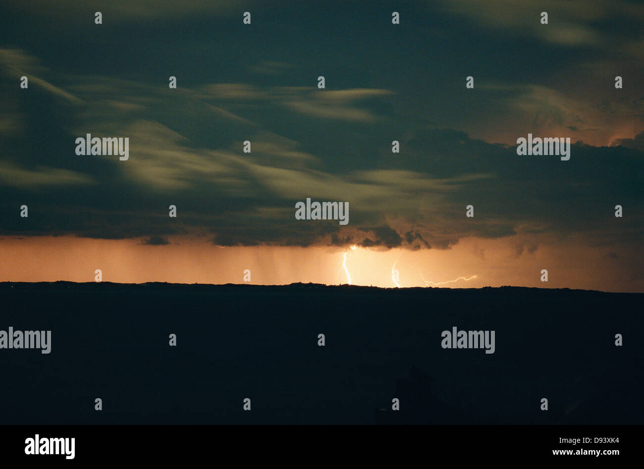 Lightning through cloudy sky Stock Photo - Alamy