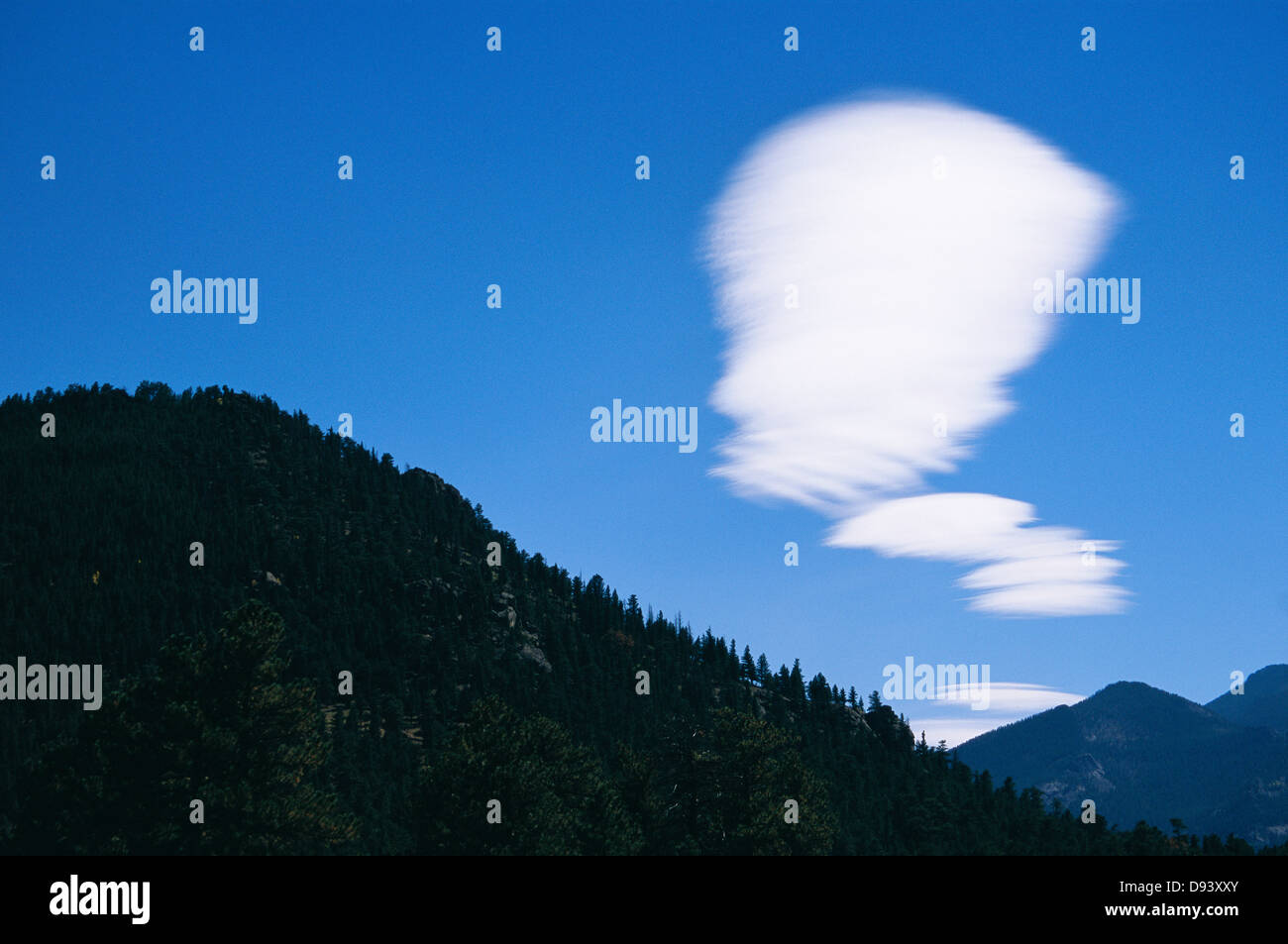Cloud over mountains Stock Photo - Alamy