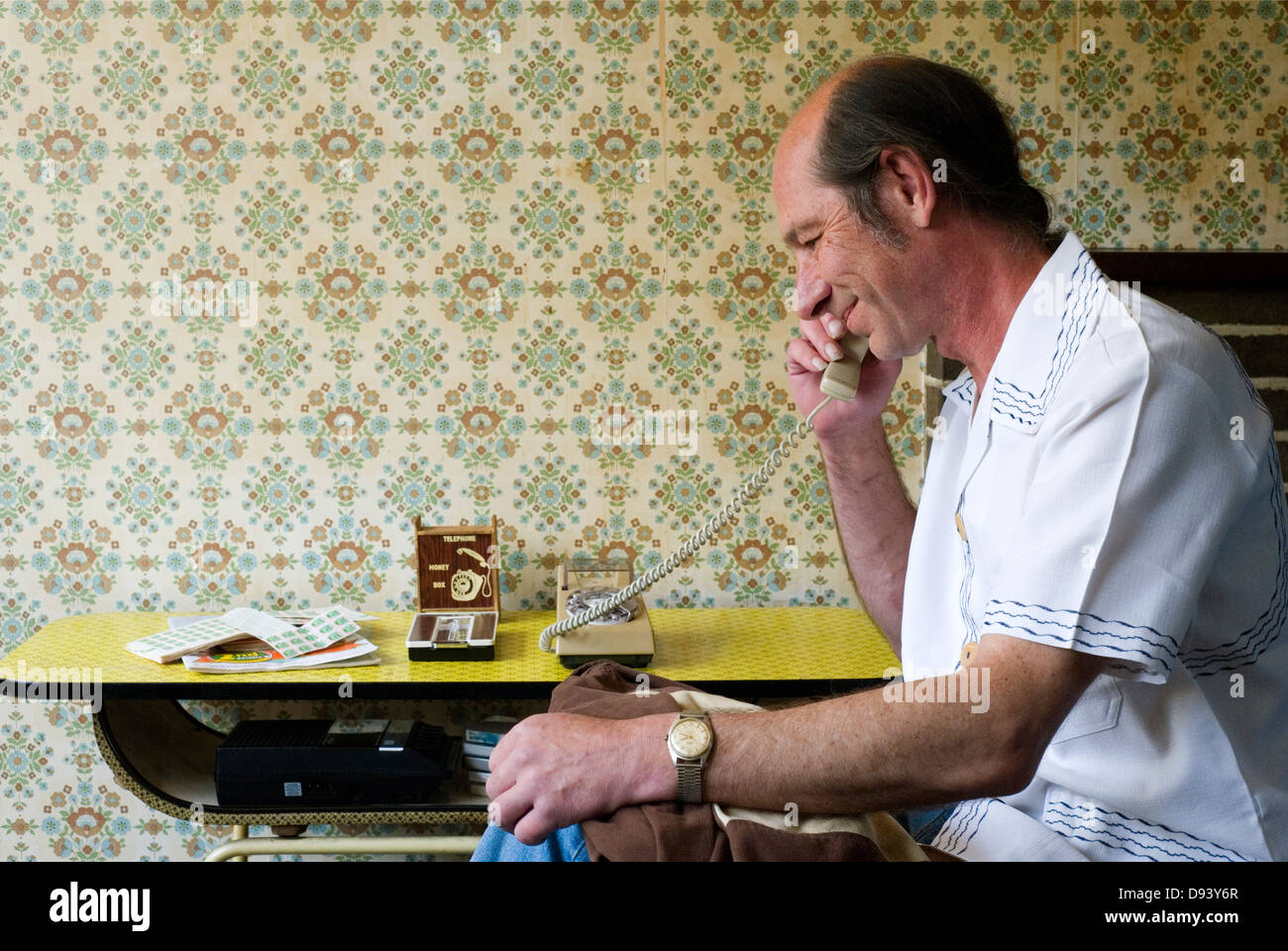 man using traditional land line telephone in his home Stock Photo - Alamy