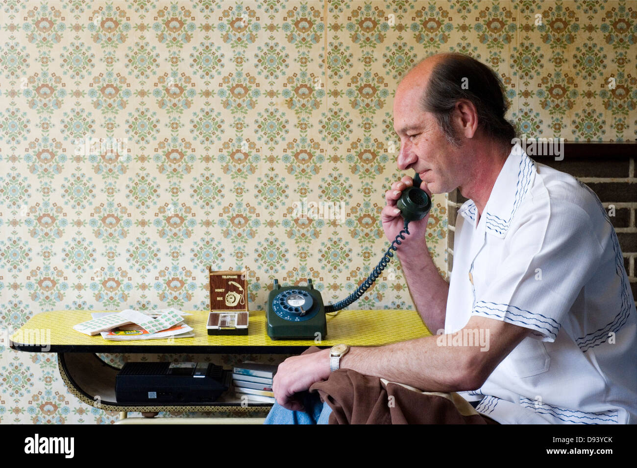 man using traditional land line telephone in his home Stock Photo - Alamy