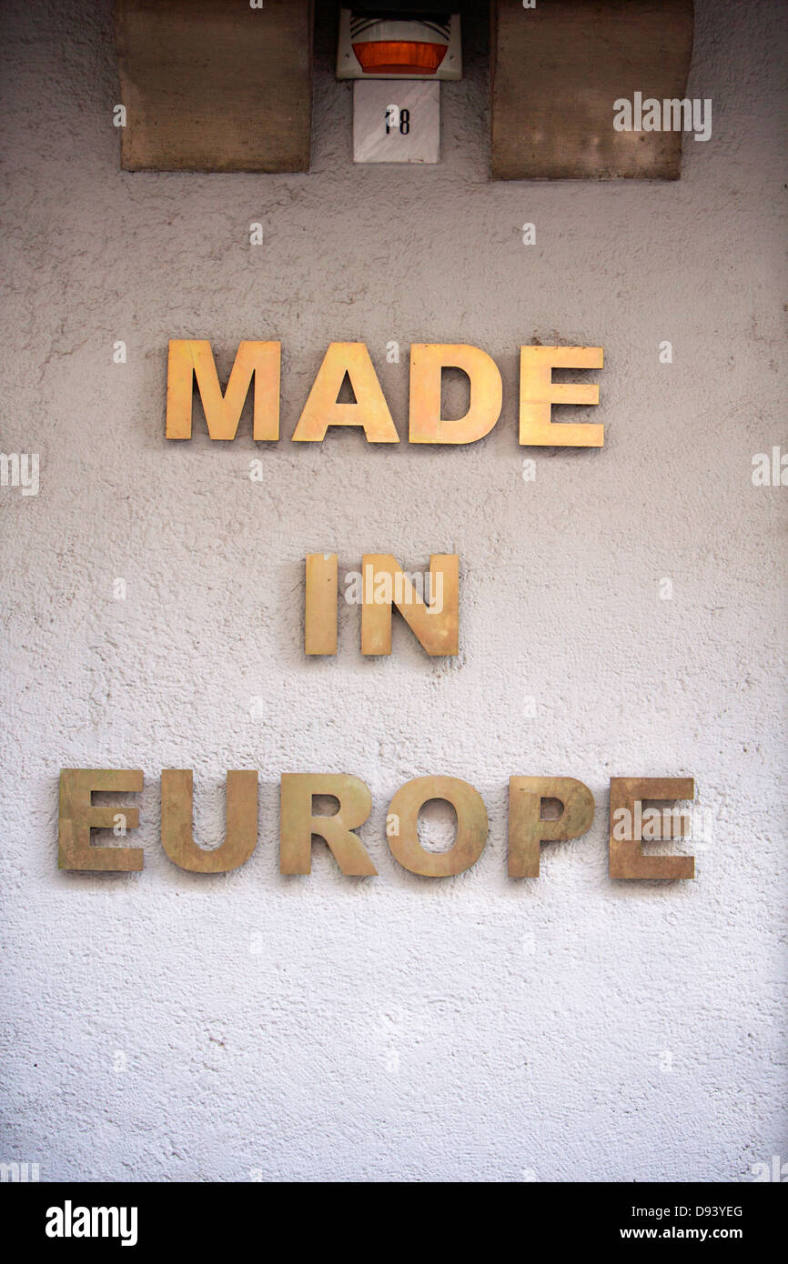 Wall with sign reading Made In Europe Stock Photo - Alamy
