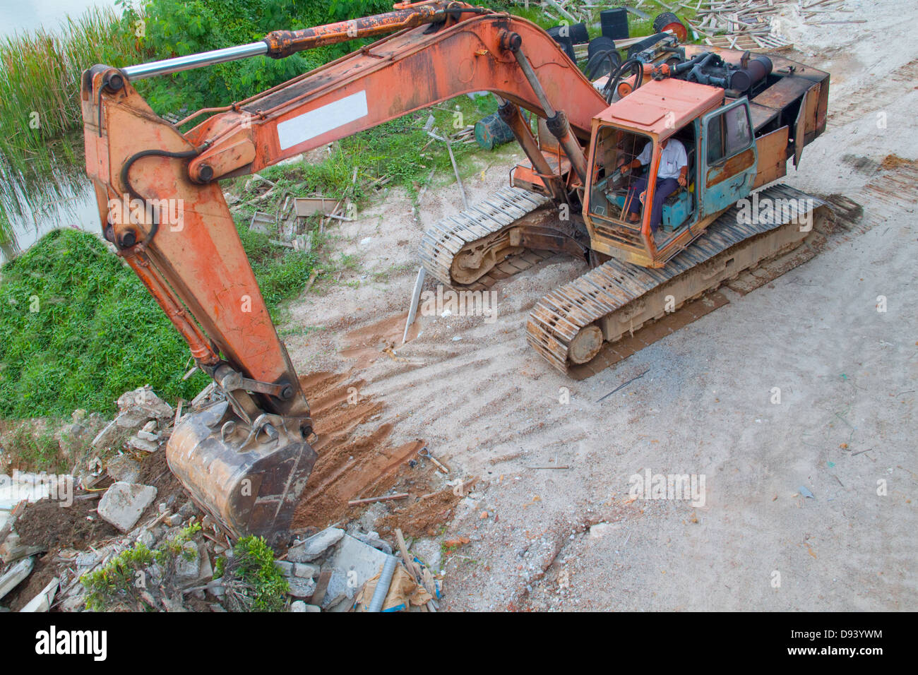 Old excavator at work. Concept of construction machinery in action ...