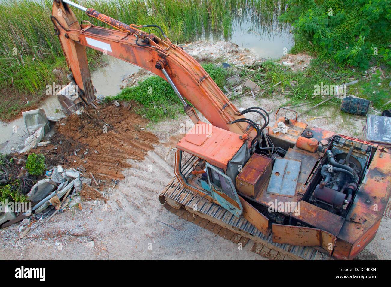 Old excavator at work. Concept of construction machinery in action ...