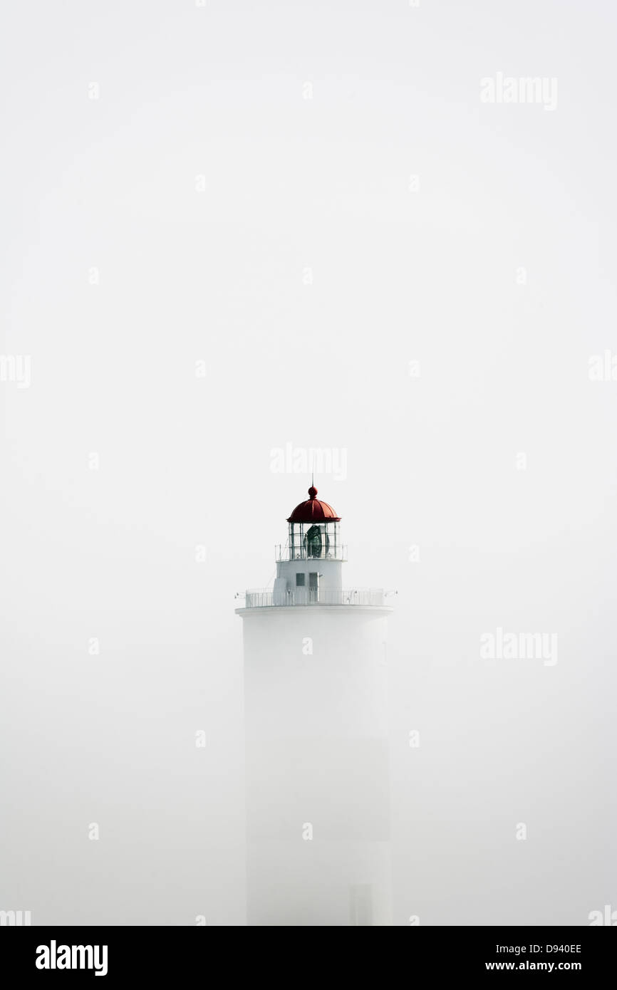 Lighthouse in fog Stock Photo - Alamy