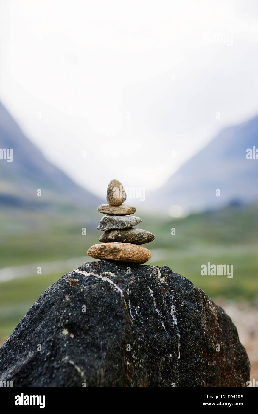 Stack of stones on rock Stock Photo - Alamy