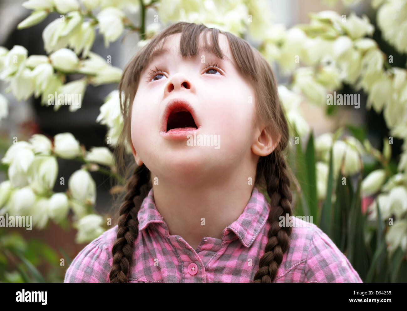 Beautiful funny girl looking up Stock Photo - Alamy
