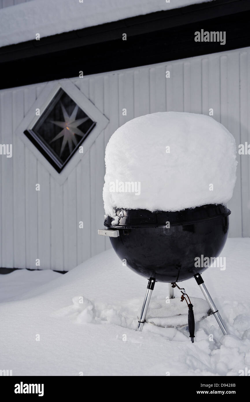 Grill covered with snow in front of house Stock Photo - Alamy