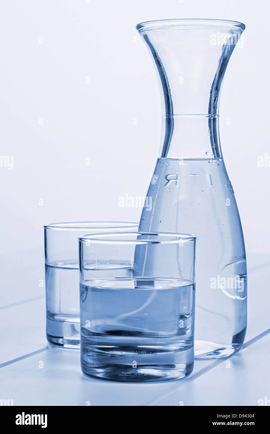 Water Carafe and Two Glasses - a carafe of water on a table with two ...