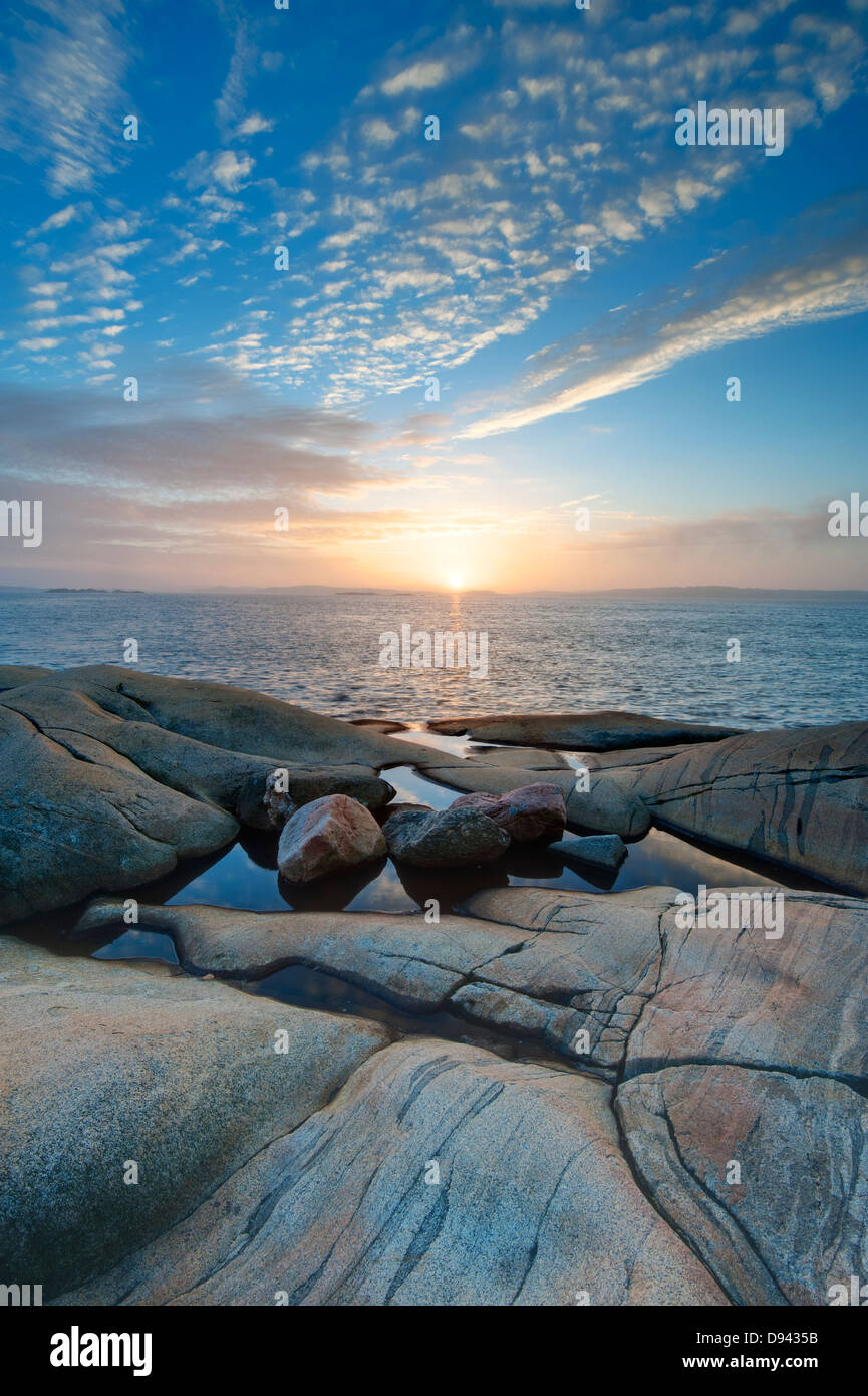 Sunset over rocky coastline hi-res stock photography and images - Alamy