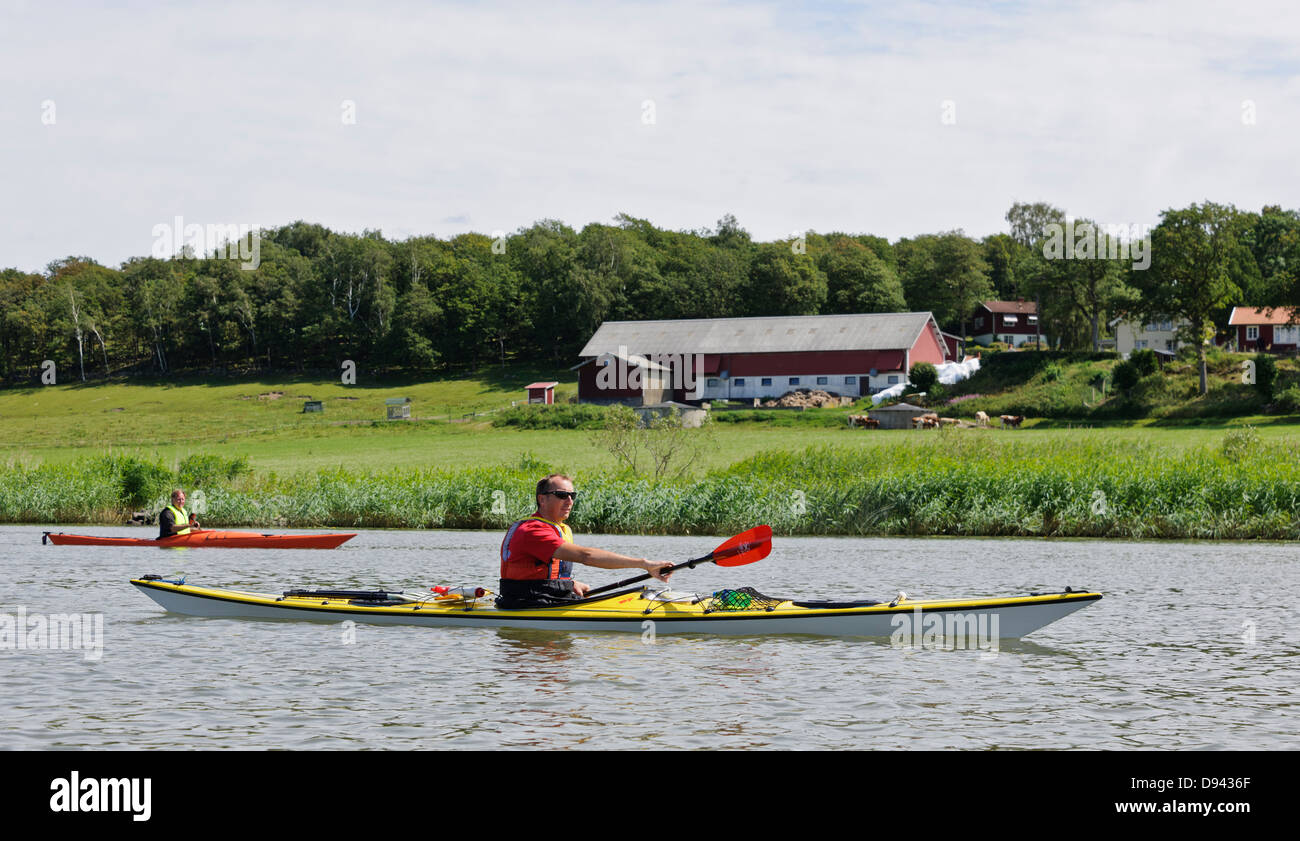 Two men in kayak Stock Photo - Alamy