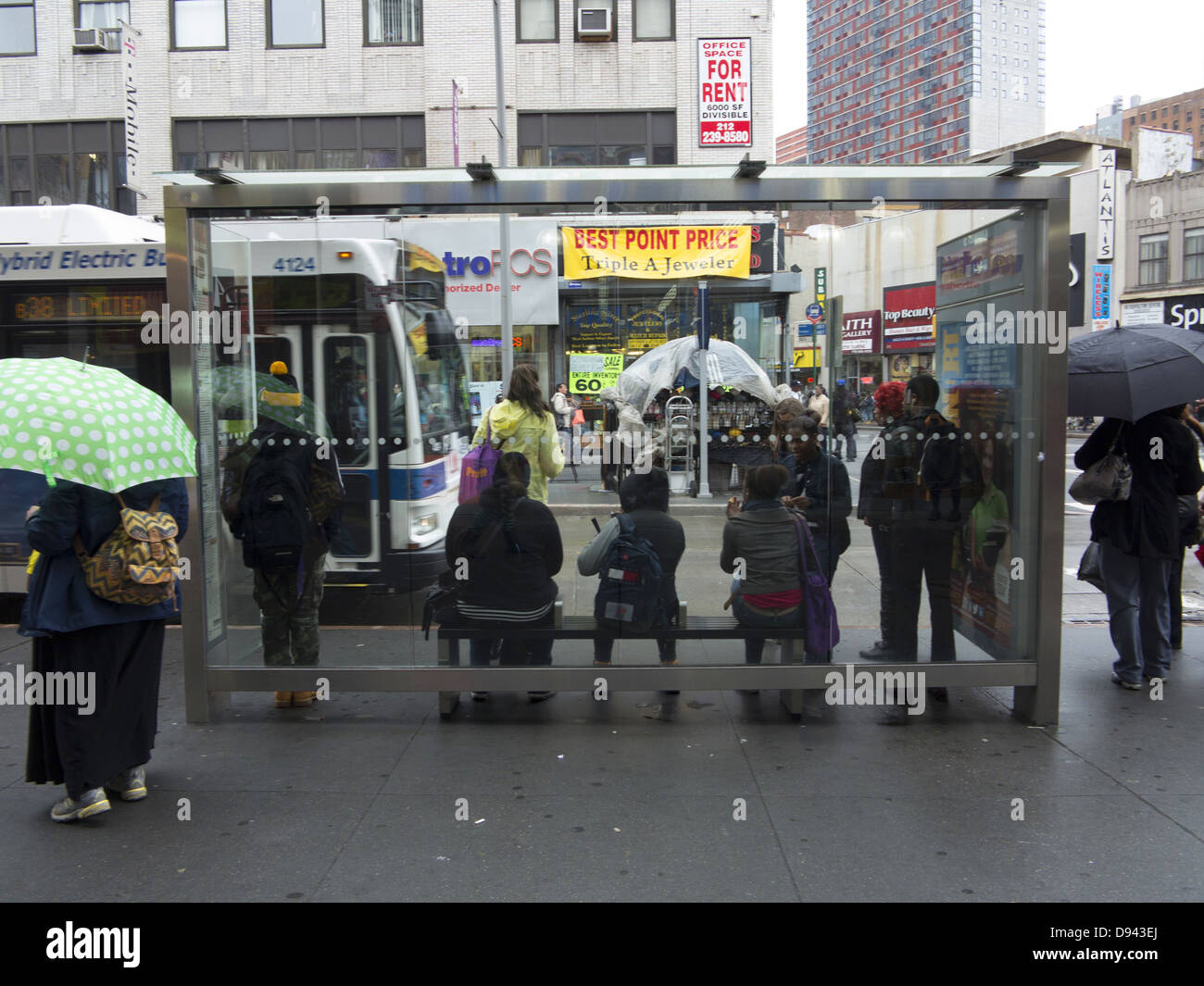 Bus stop, rainy day Fulton Street, Brooklyn, NY Stock Photo - Alamy