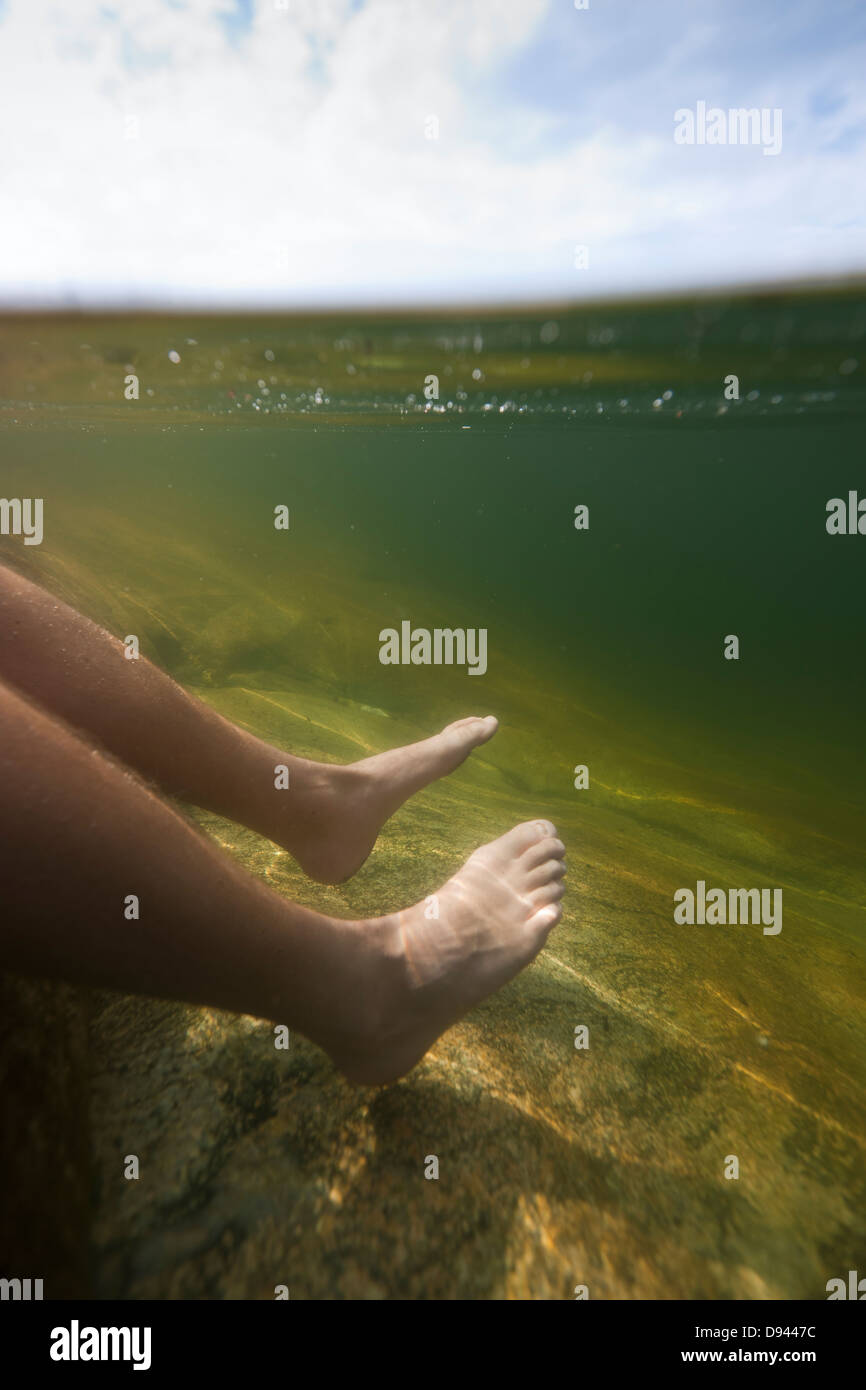 Human legs in lake Stock Photo - Alamy