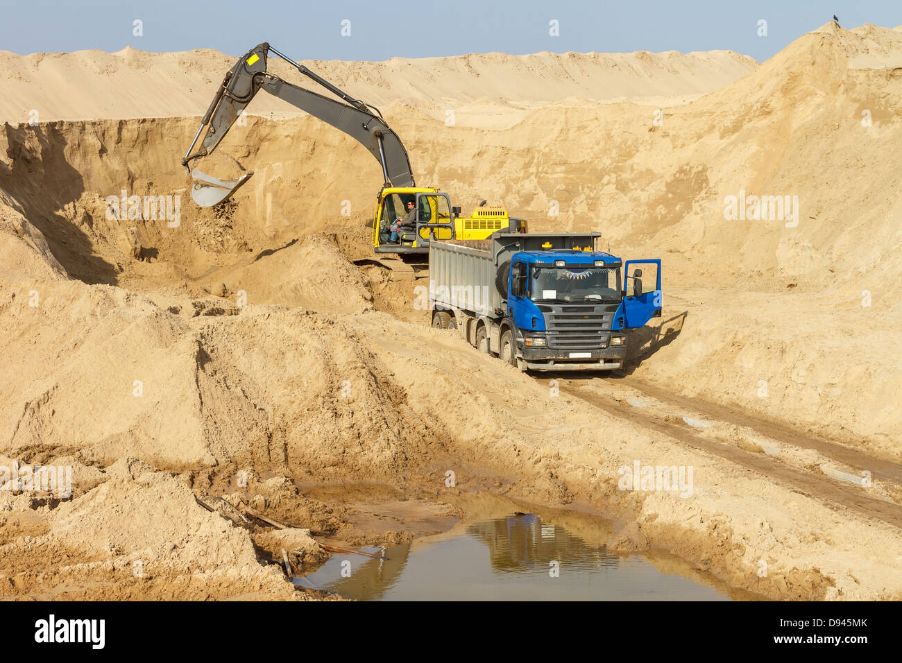 Working Yellow Excavator at Construction Site Stock Photo - Alamy
