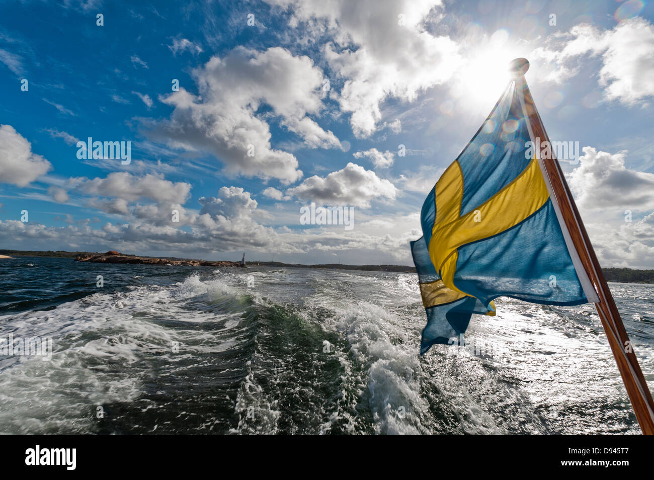 Swedish flag on stem of boat at sea Stock Photo - Alamy