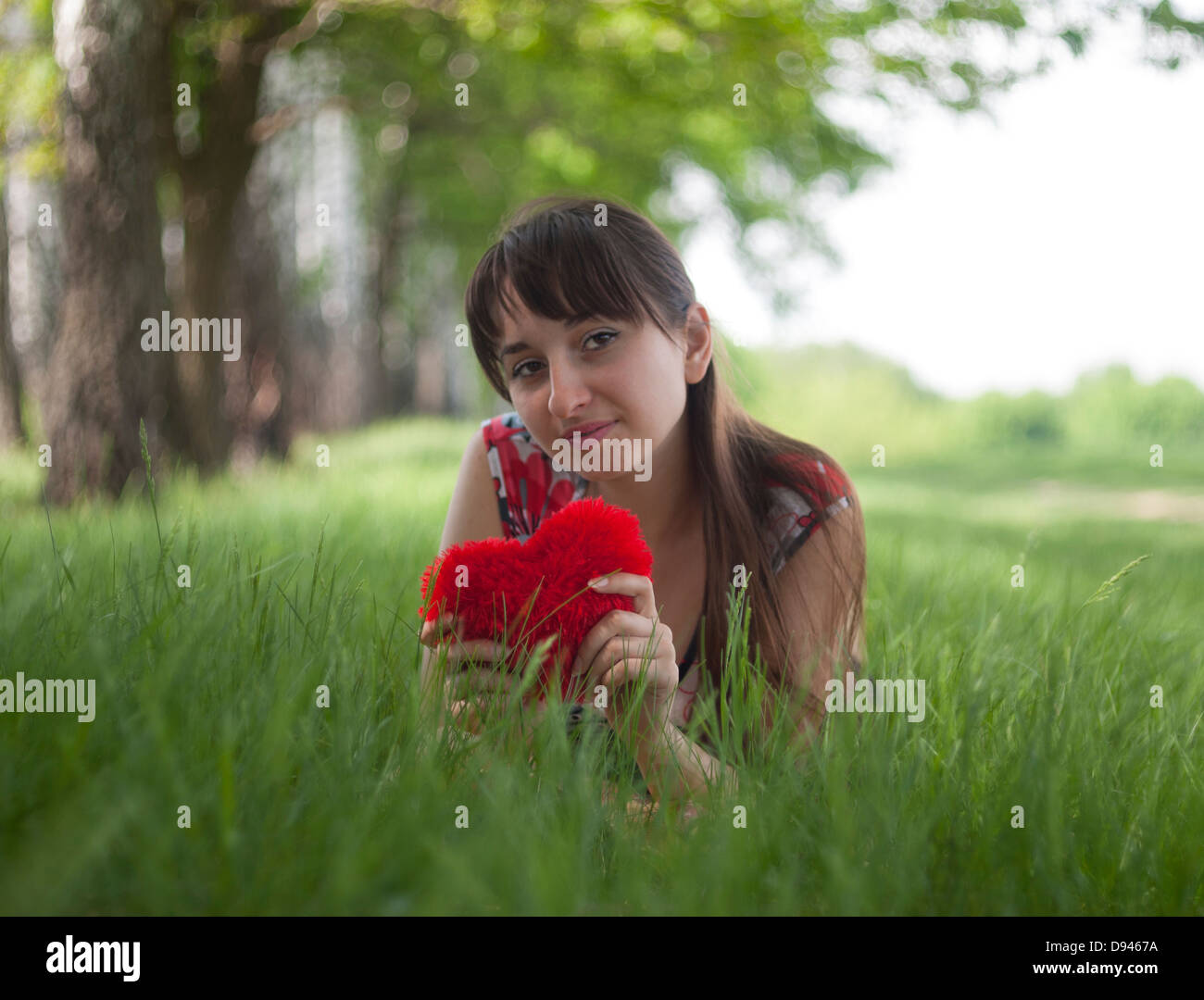 Girl lying grass field hi-res stock photography and images - Alamy