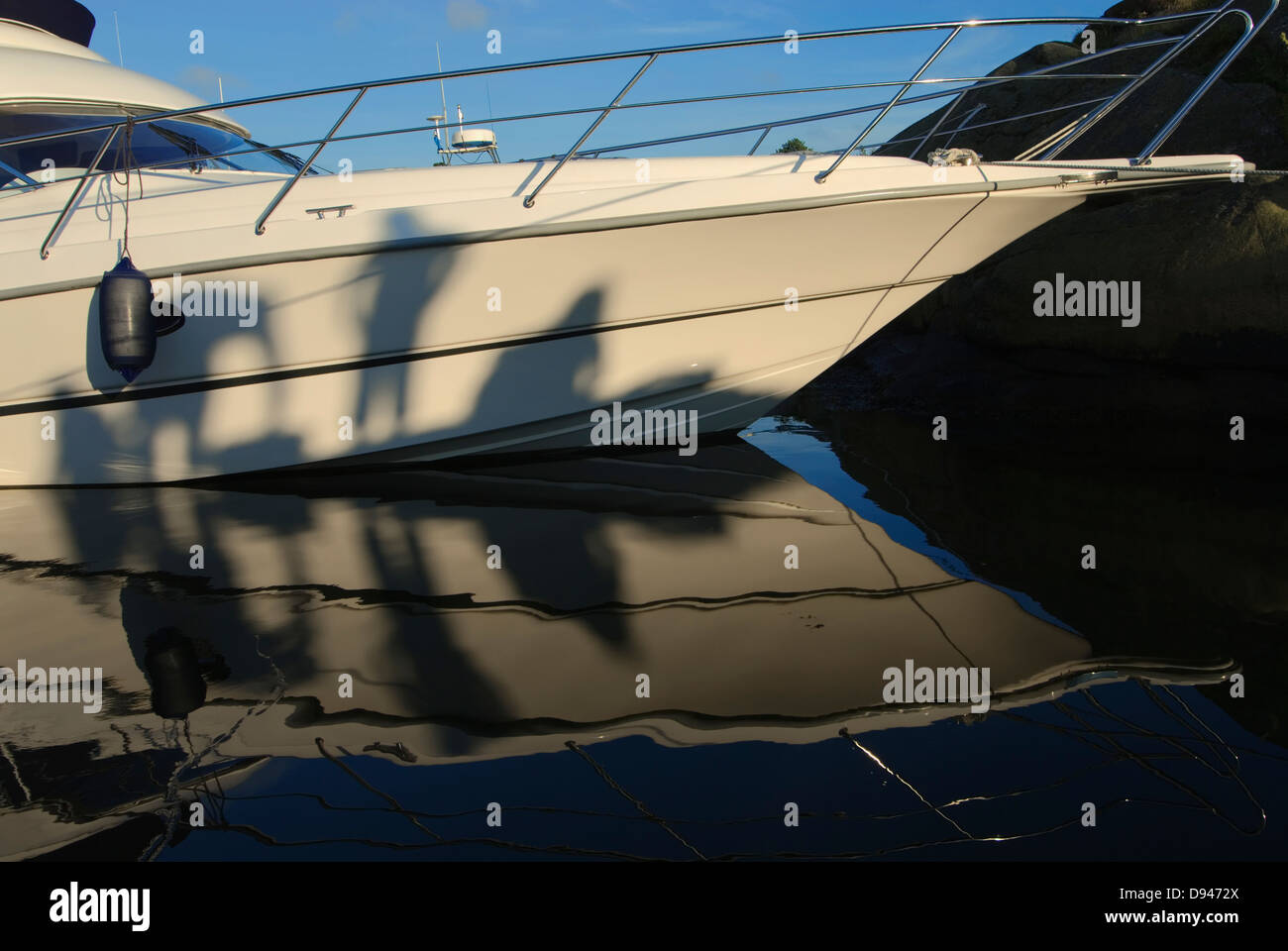 Shadows of humans along a boat Stock Photo - Alamy