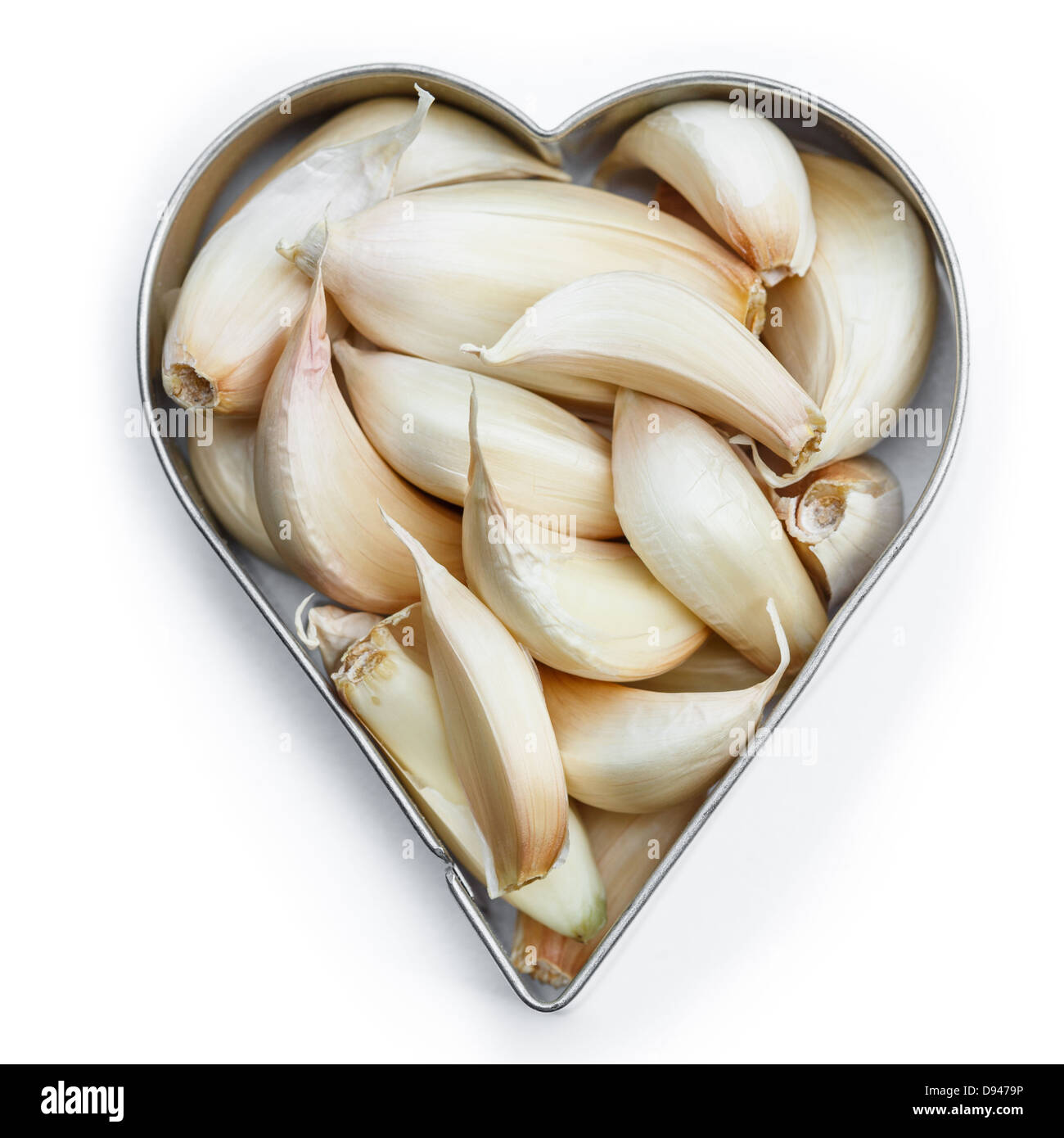 Garlic cloves in heart shape Stock Photo - Alamy