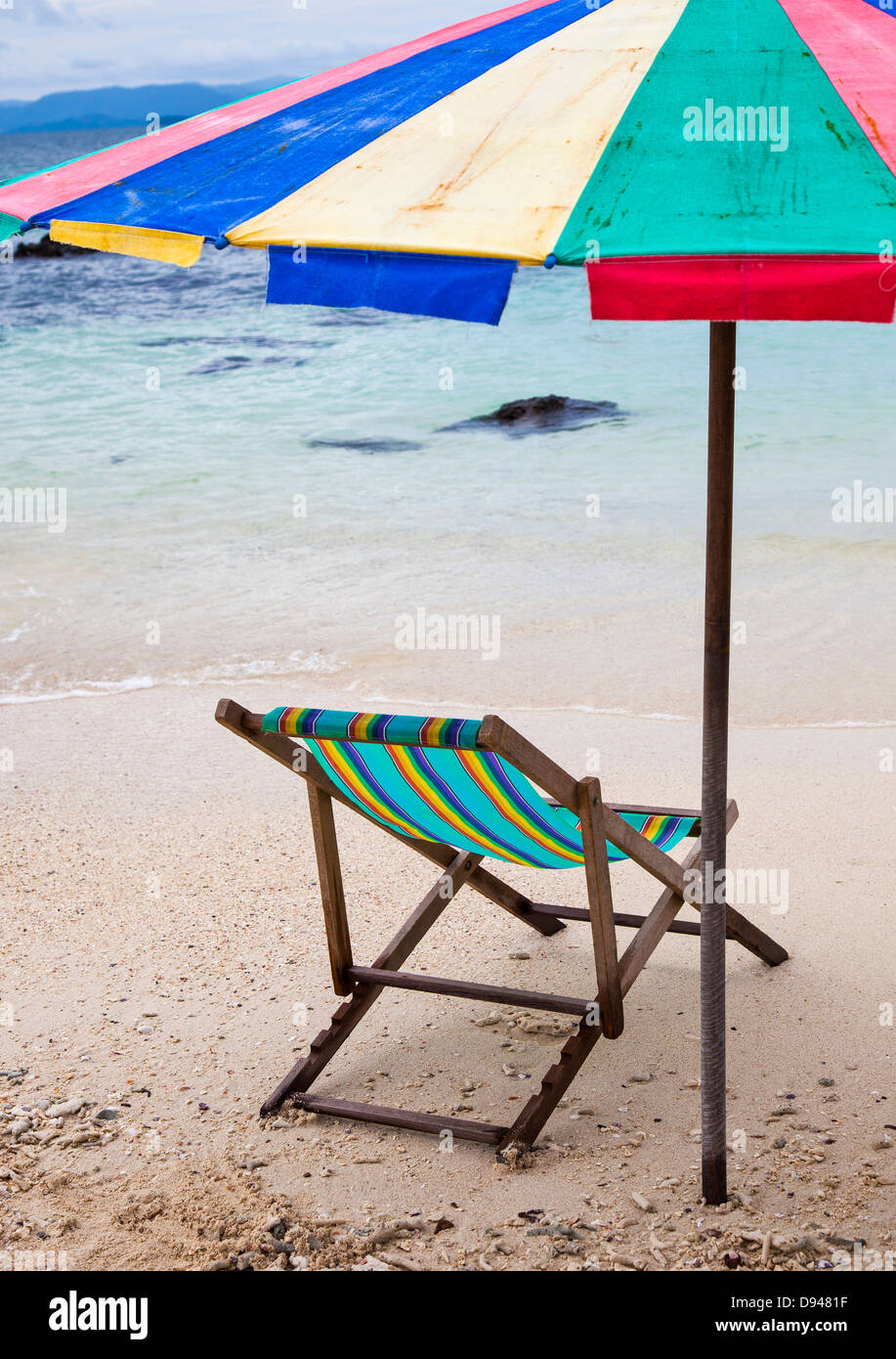 Sun chair and parasol on beach Stock Photo - Alamy