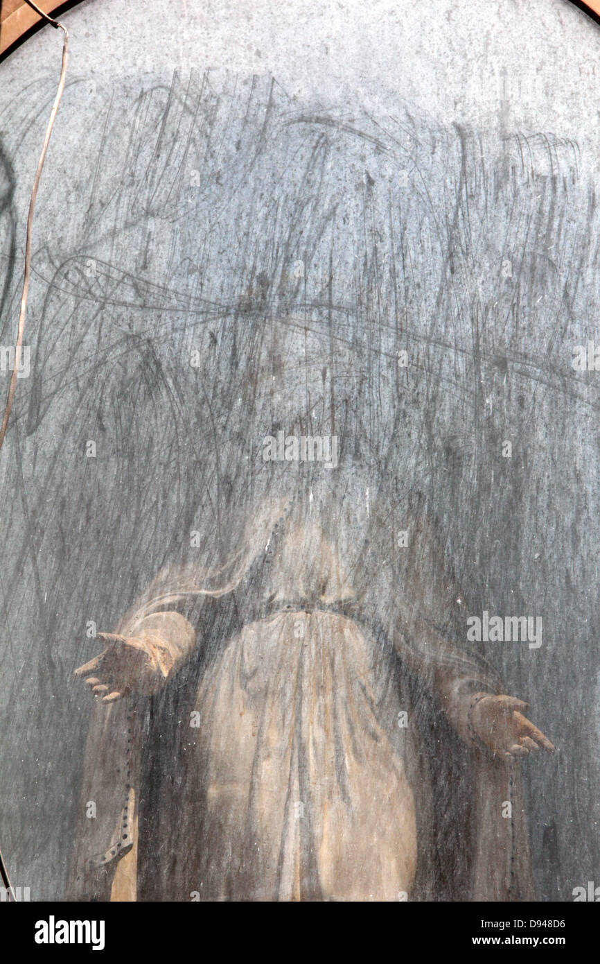 female religious statue in street side altar by church in rome italy ...