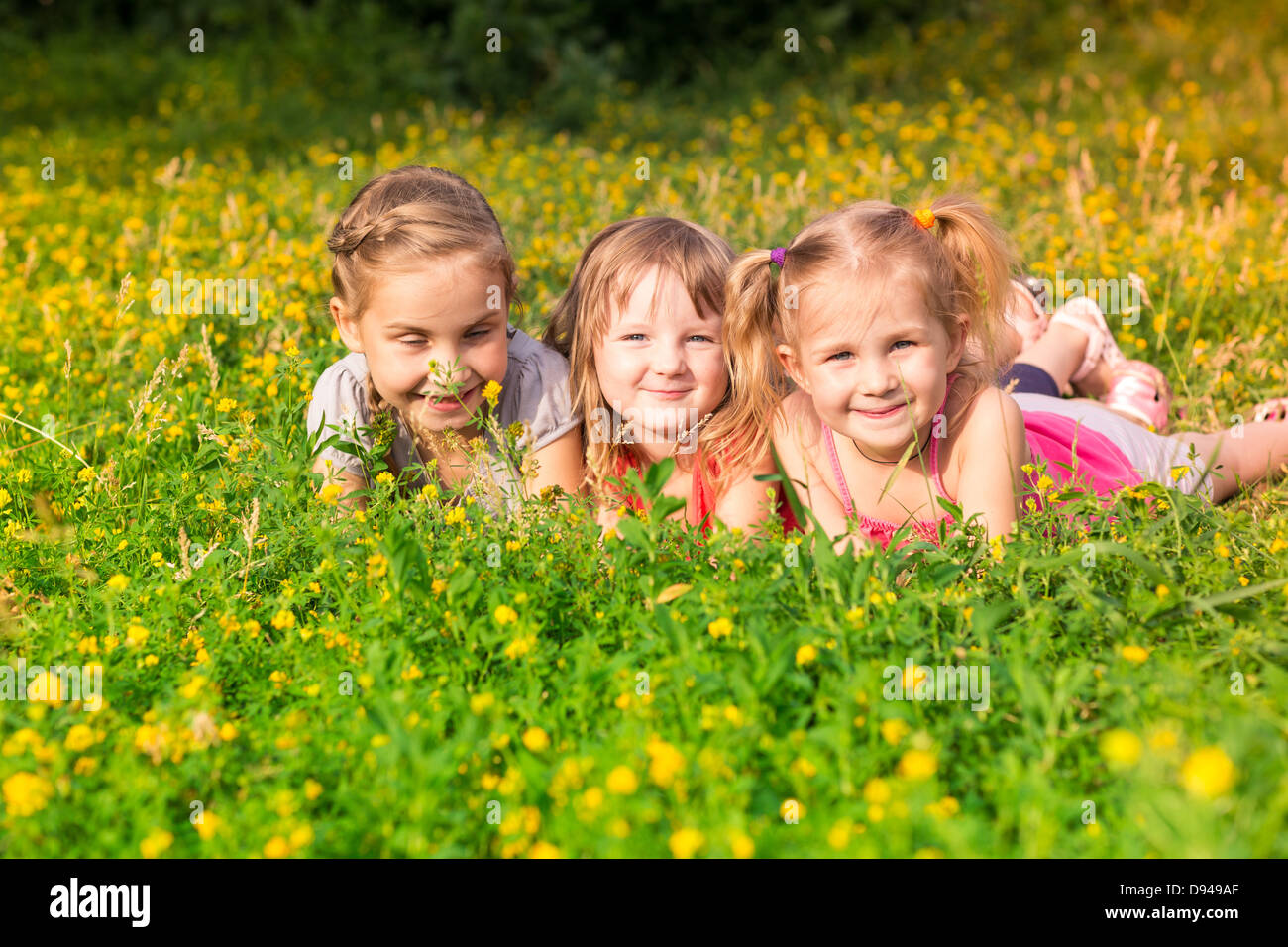 Happy smiling little kids outdoor in the park in summertime Stock Photo ...